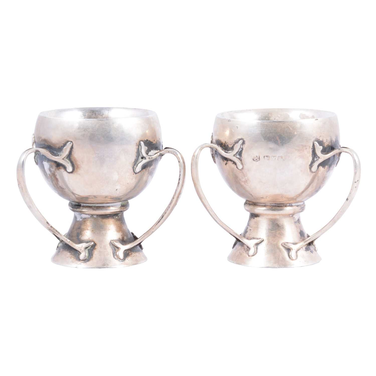 Lot 274 - A pair of small silver cups in an Art