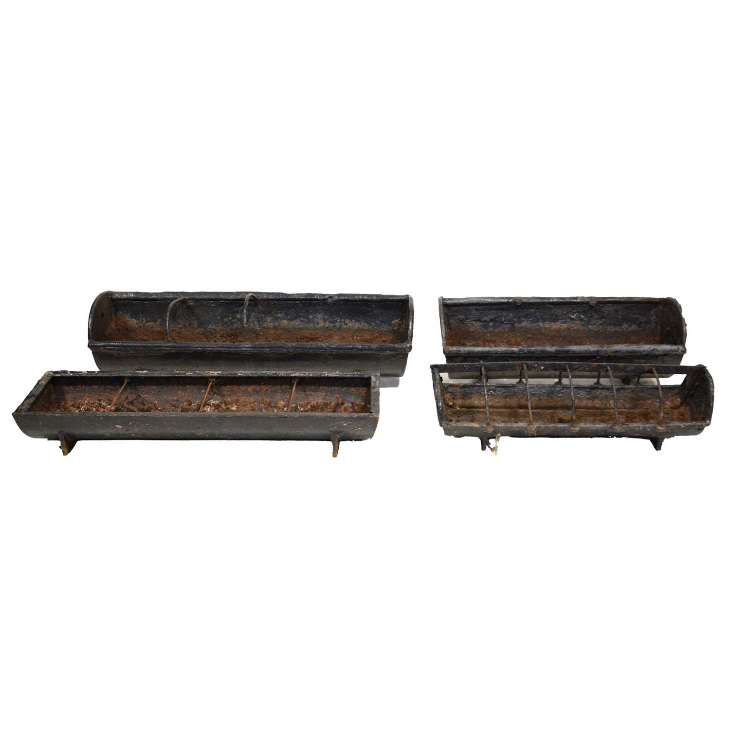 Lot 465 - Four cast iron pig troughs.