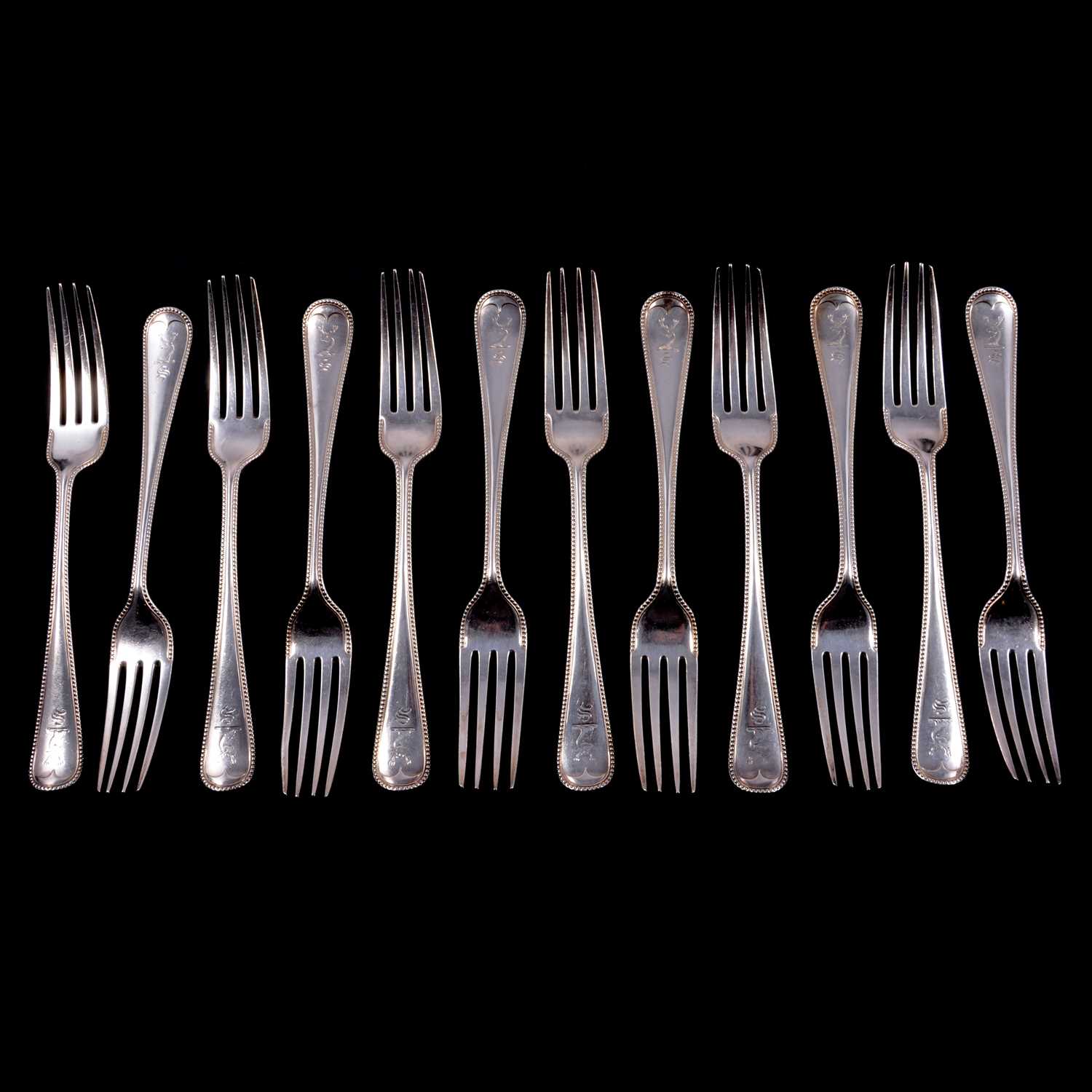 Lot 54 - Set of twelve silver table forks,