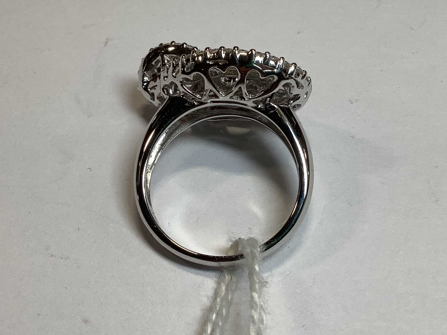 Lot 96 - A diamond loop ring.