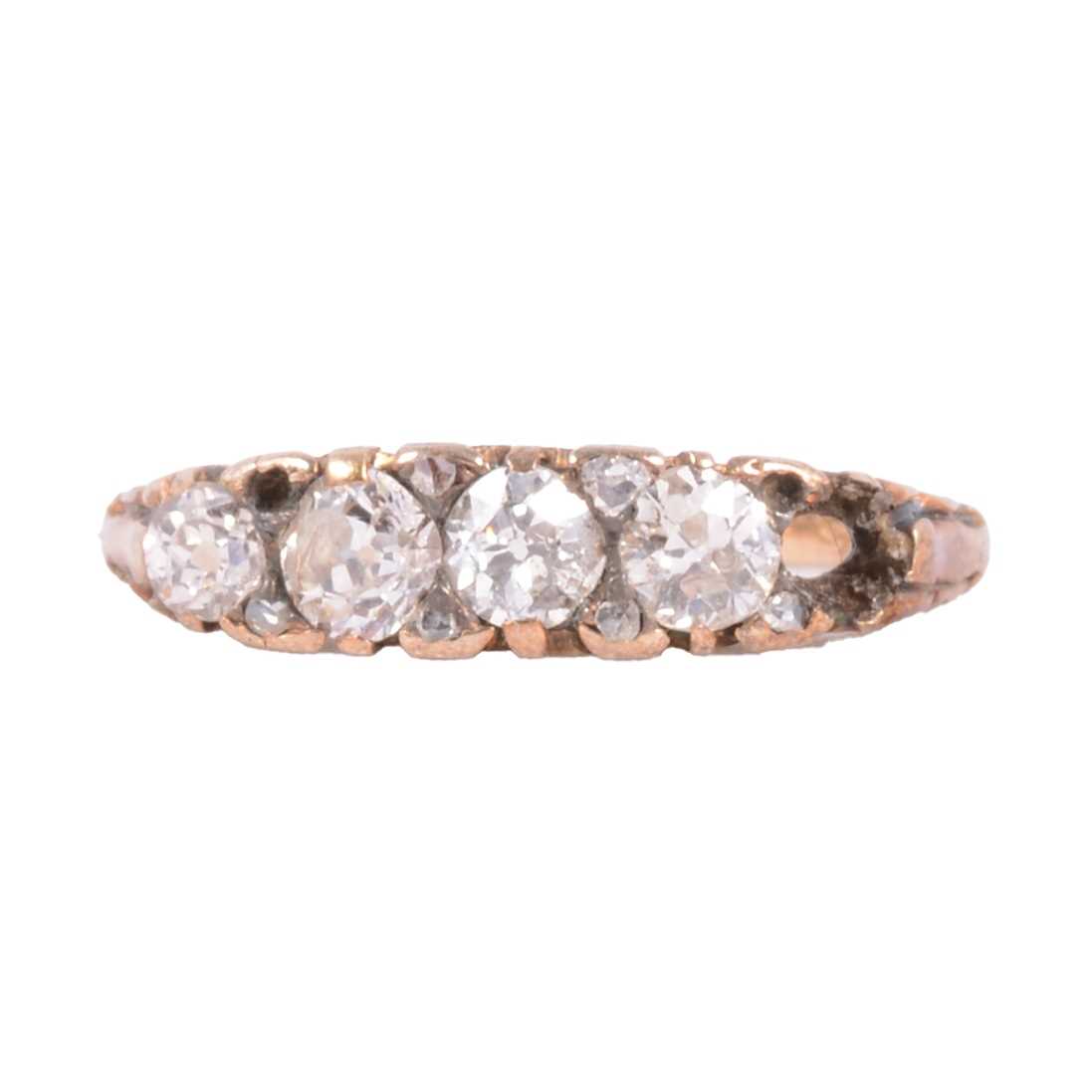 Lot 101 - A diamond half hoop ring.