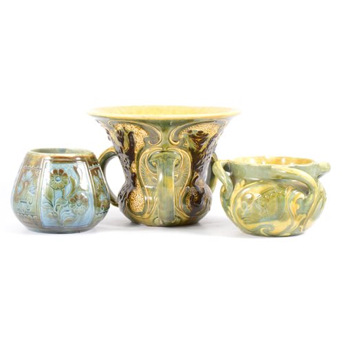Lot 380 - C.H. Brannam, three Barum Ware pottery vases,