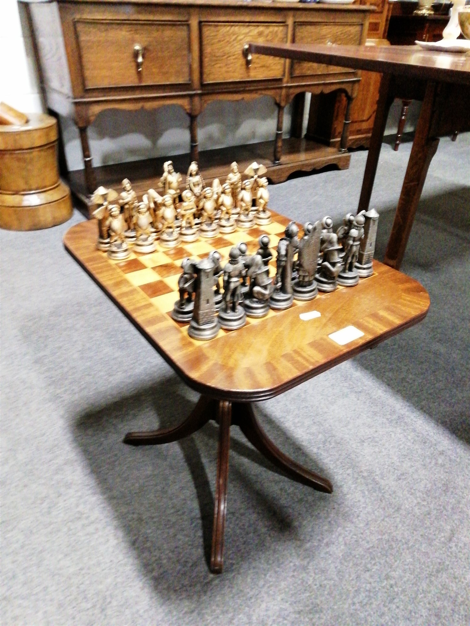 Lot 424 - A small chess table with cast metal chess