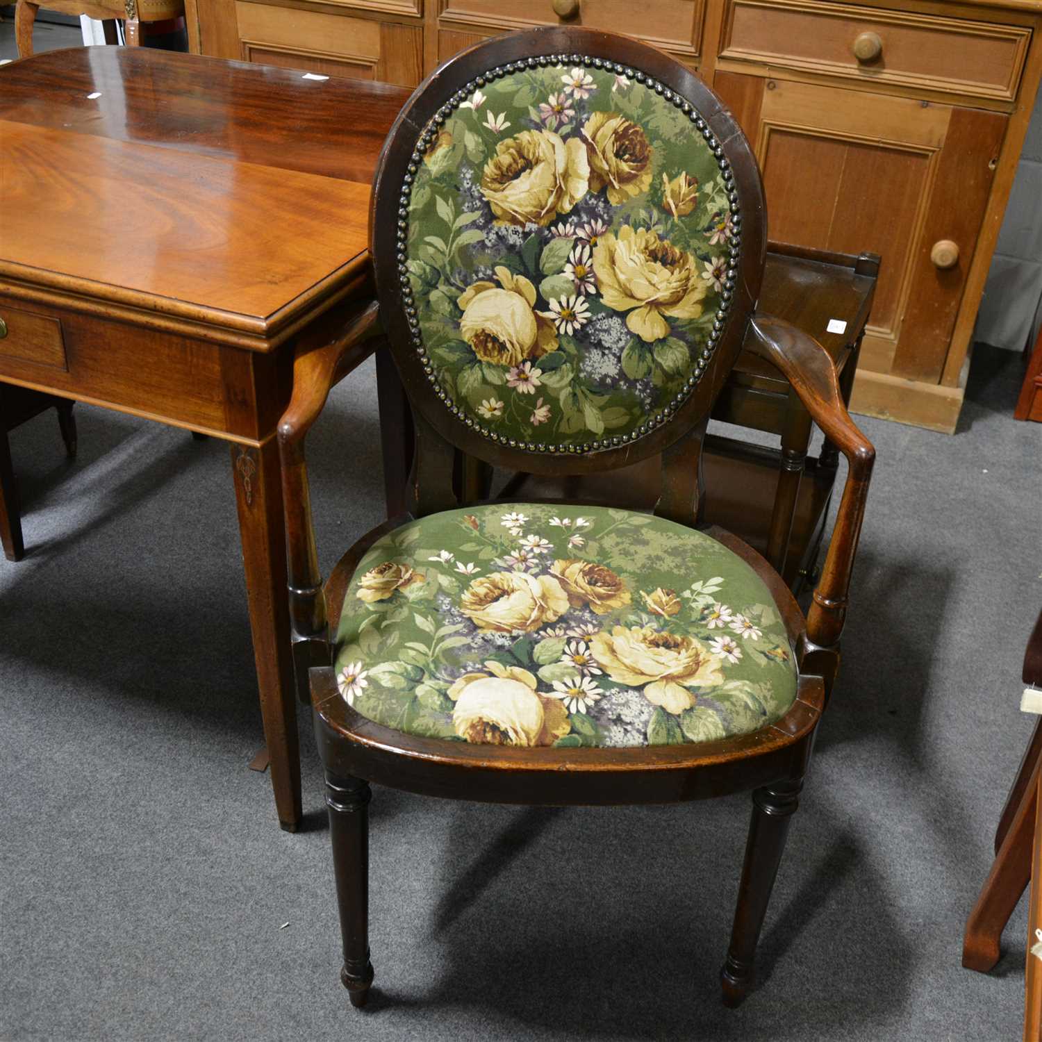 Lot 571 - A stained wood elbow chair,