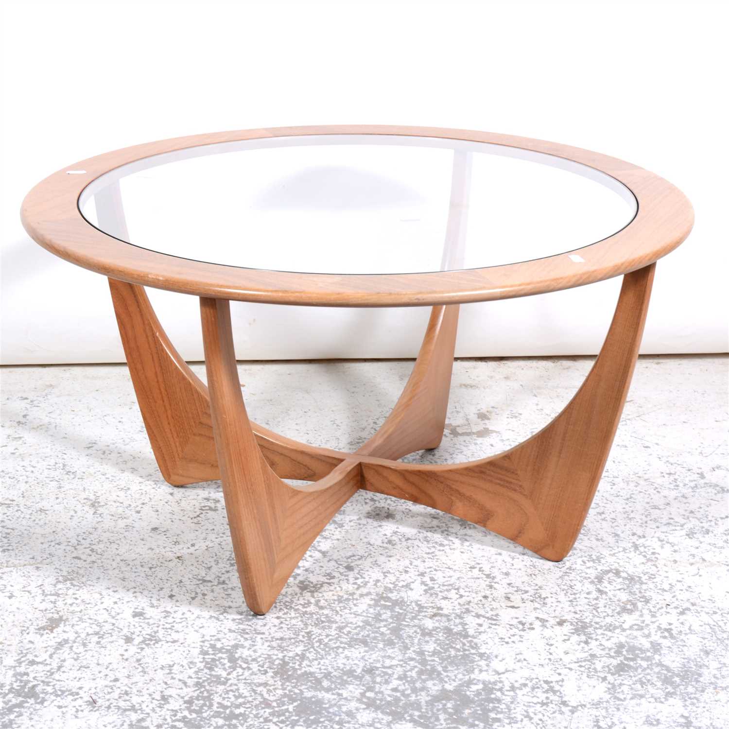 Lot 320 - Teak glass top circular coffee table, by