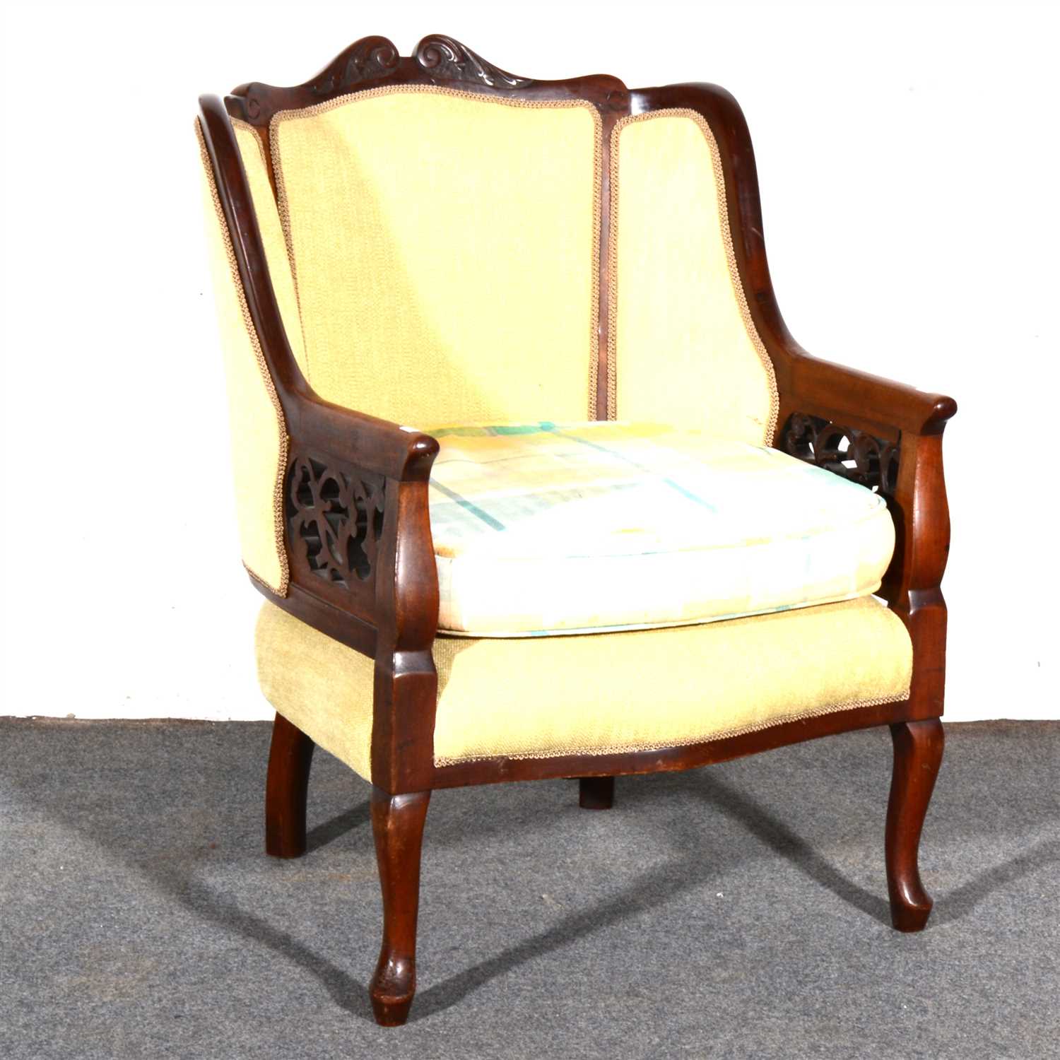 Lot 392 - A late Victorian mahogany easychair, carved