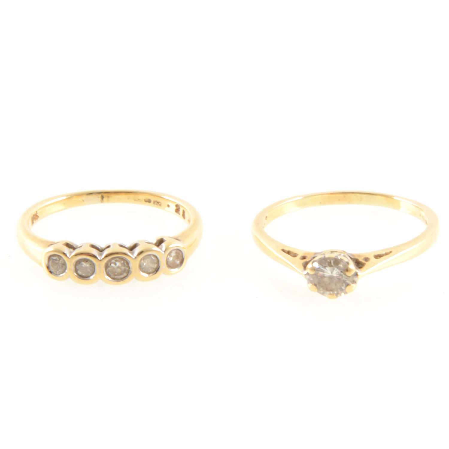 Lot 242 - Two diamond rings, a solitaire and a five