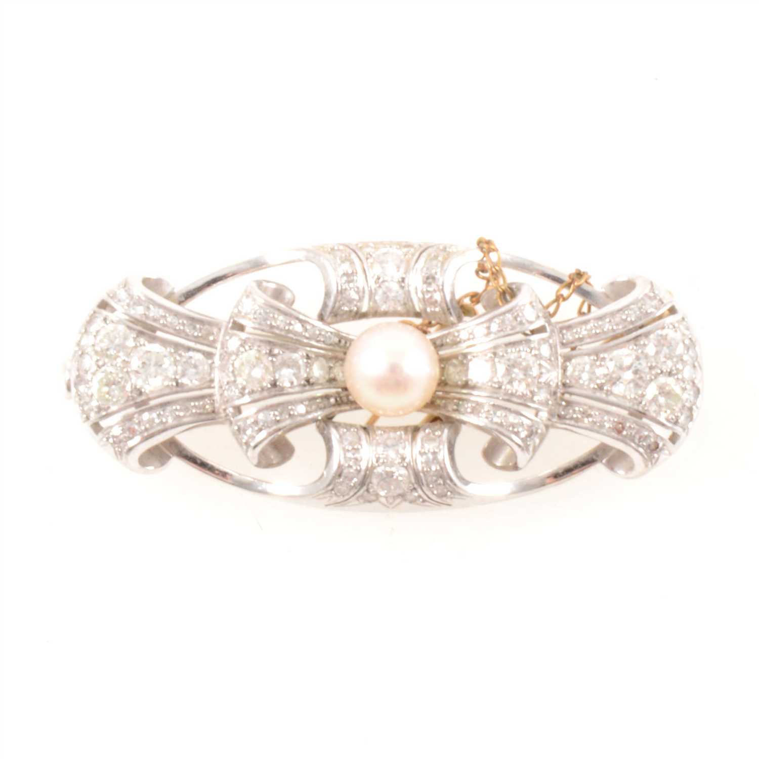 Lot 361 - A diamond and pearl brooch.