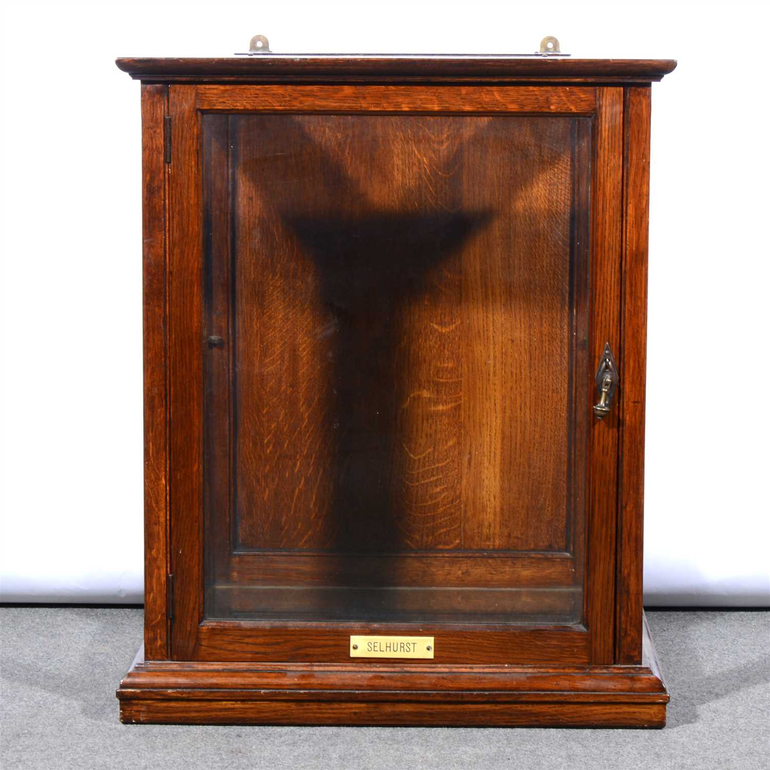 Lot 624 - A stained oak trophy cabinet,