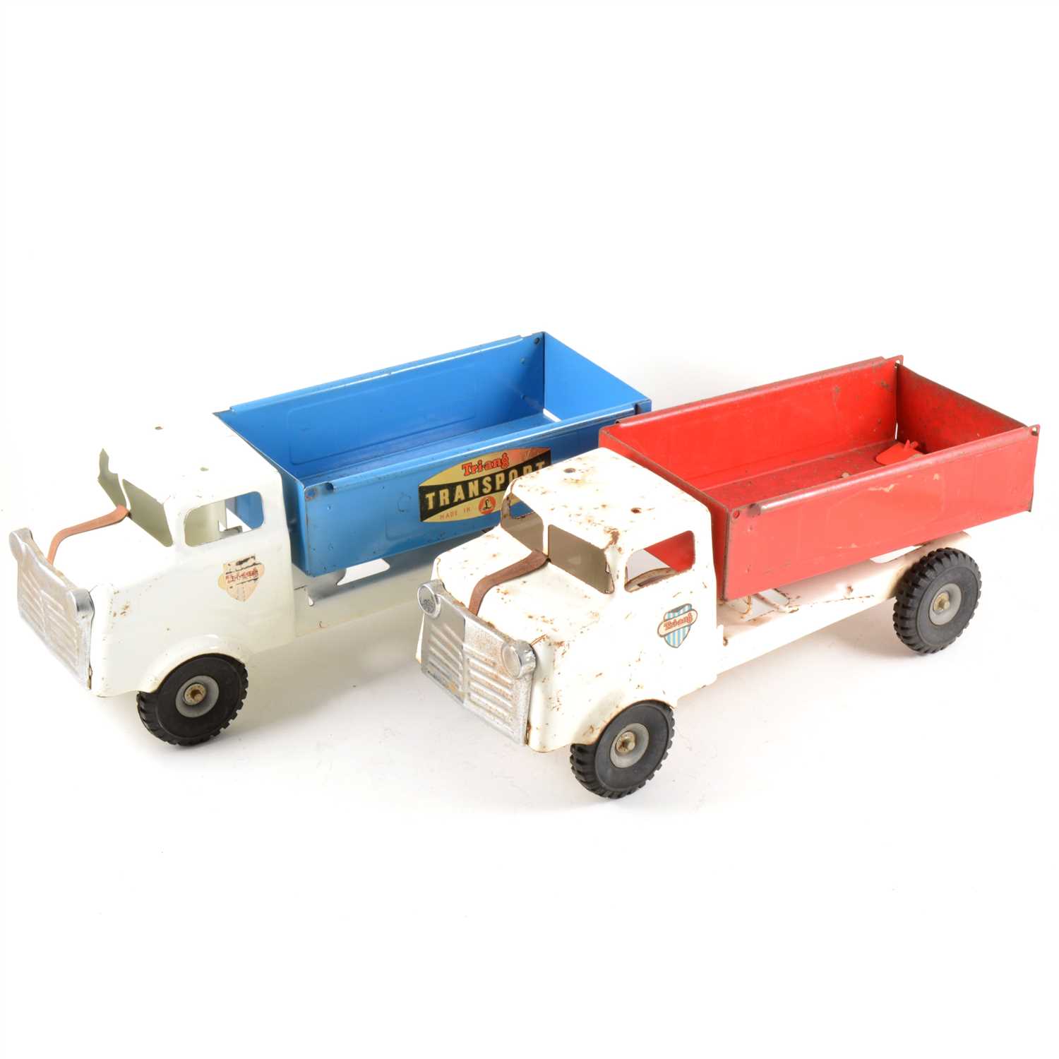 Lot 122 - Tri-ang tin-plate trucks; four including two