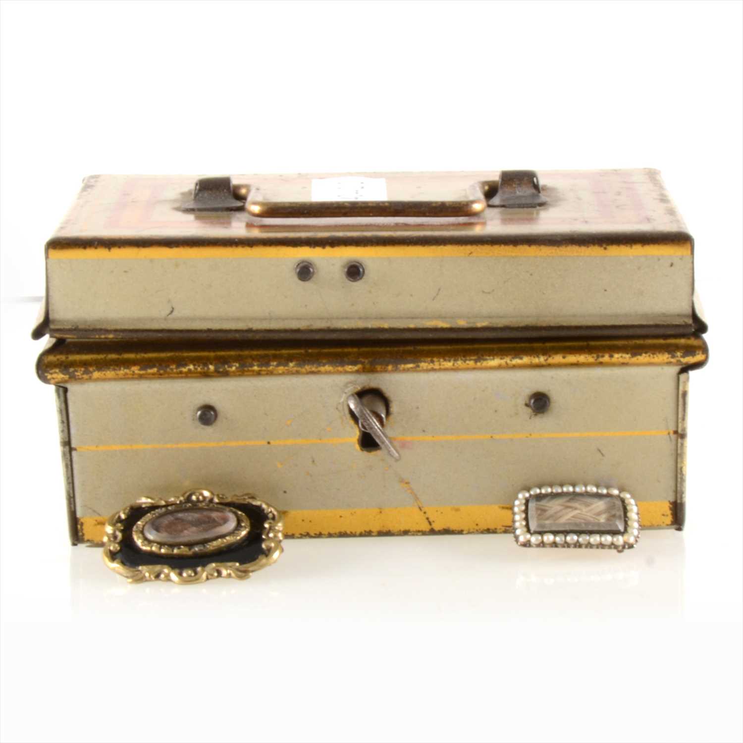 Lot 337 - A locking tin box containing two Victorian