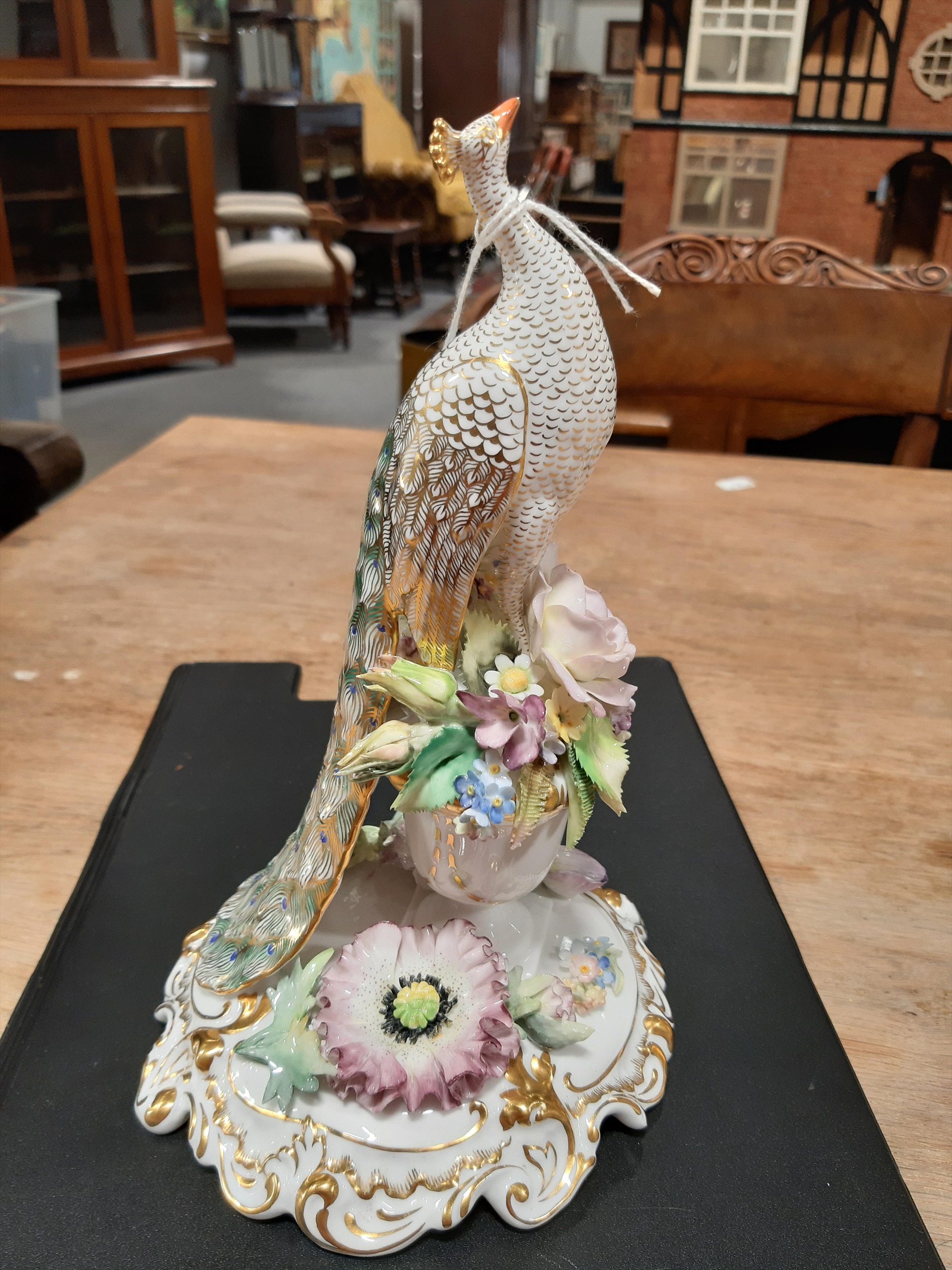 Lot 98 Two Royal Crown Derby Peacock Models