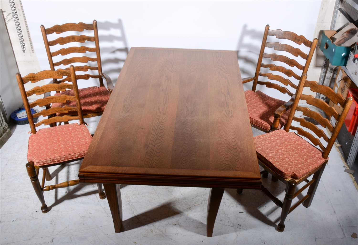 Lot 297 - An oak dining table, and six beech wavy-back