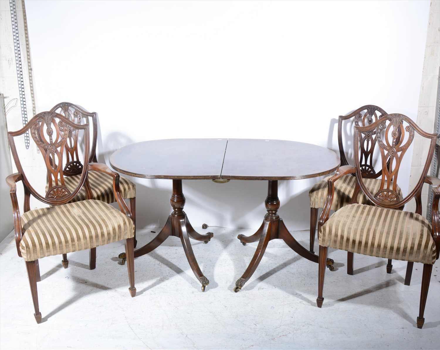 Lot 455 - George III style mahogany dining table and