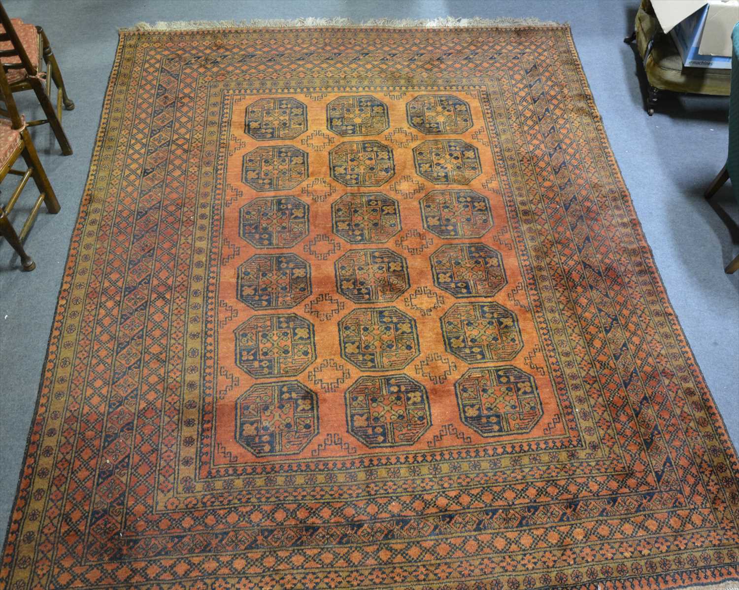 Lot 522 - A Bokhara Afghan pattern carpet