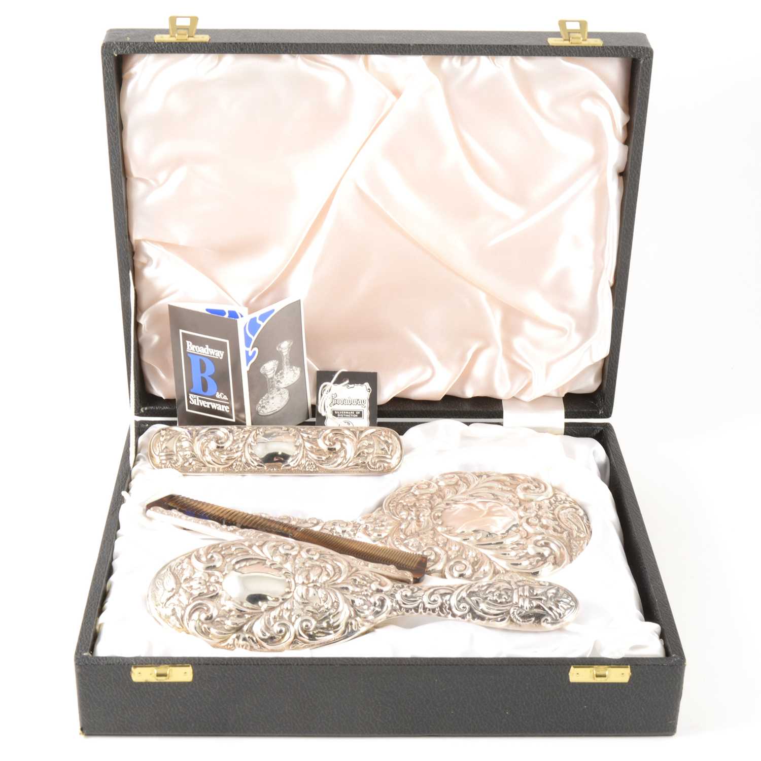 Lot 272 - A four piece silver dressing table set in