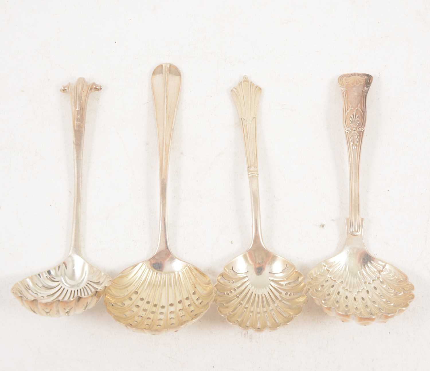 Lot 1204 - Four silver sugar sifting spoons, Sheffield.