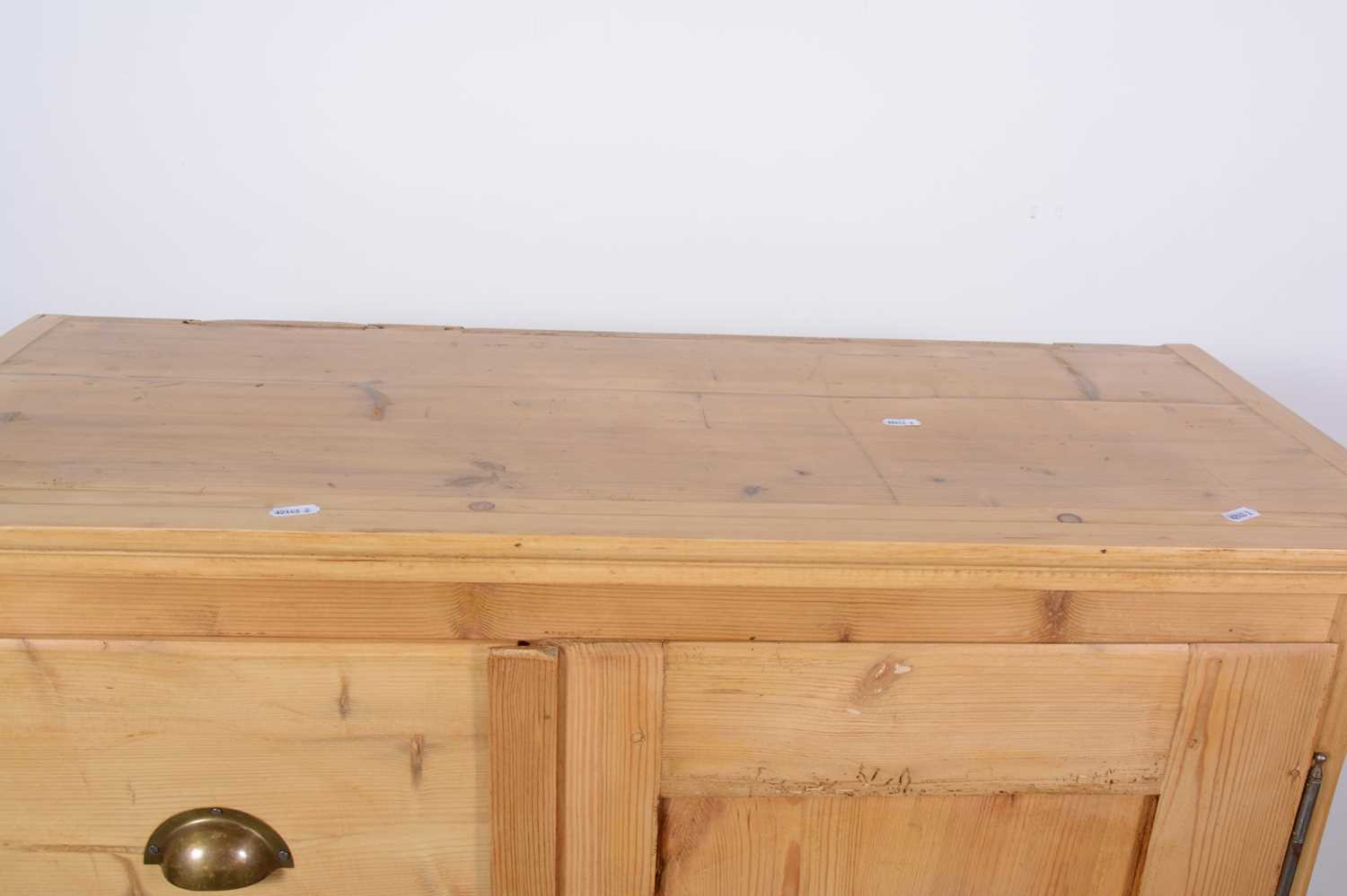 Lot 133 - A pine pantry cupboard
