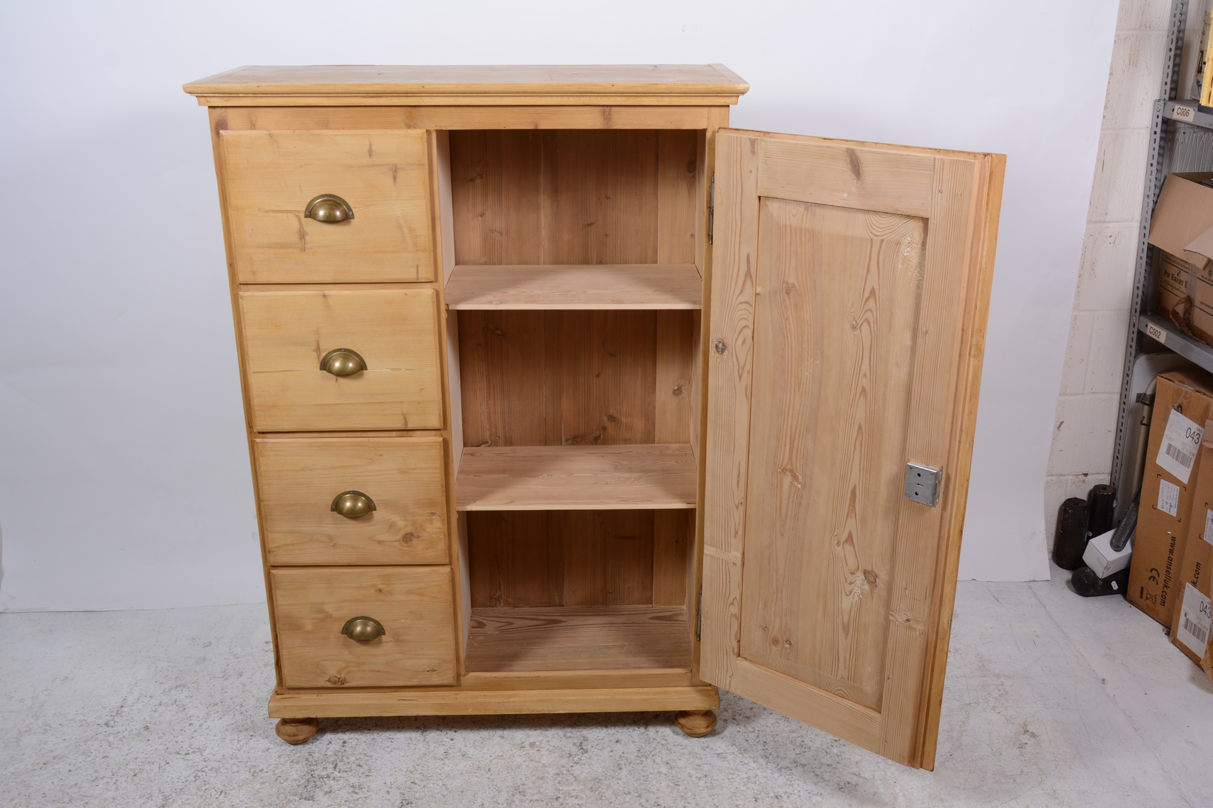 Lot 133 - A pine pantry cupboard