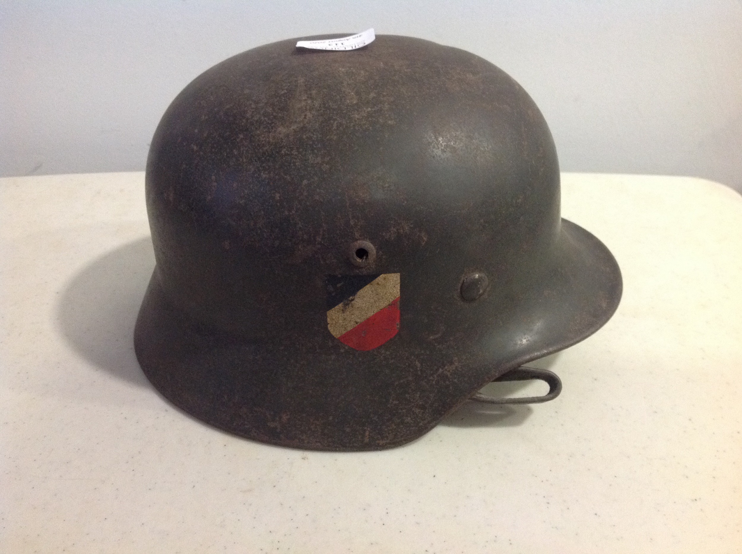 Lot 113 - WWII German steel war helmet with side