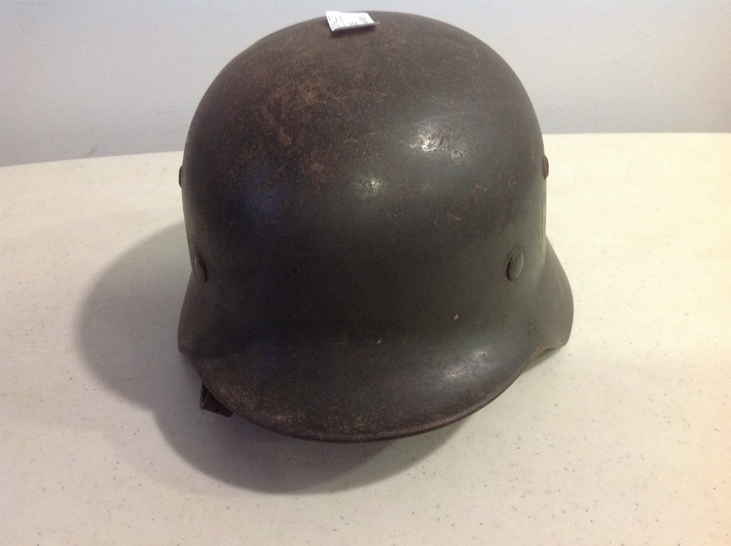 Lot 113 - WWII German steel war helmet with side