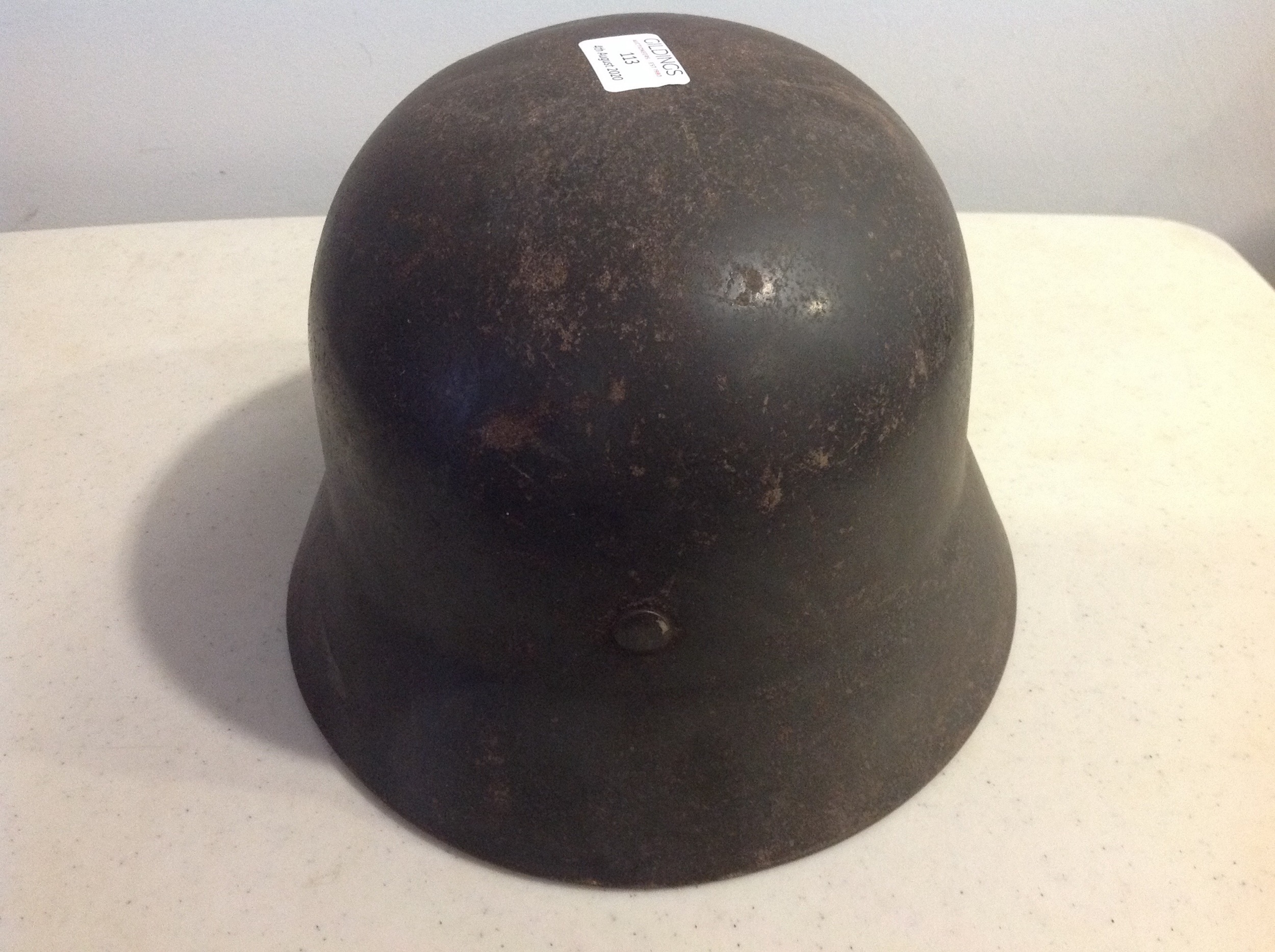 Lot 113 - WWII German steel war helmet with side