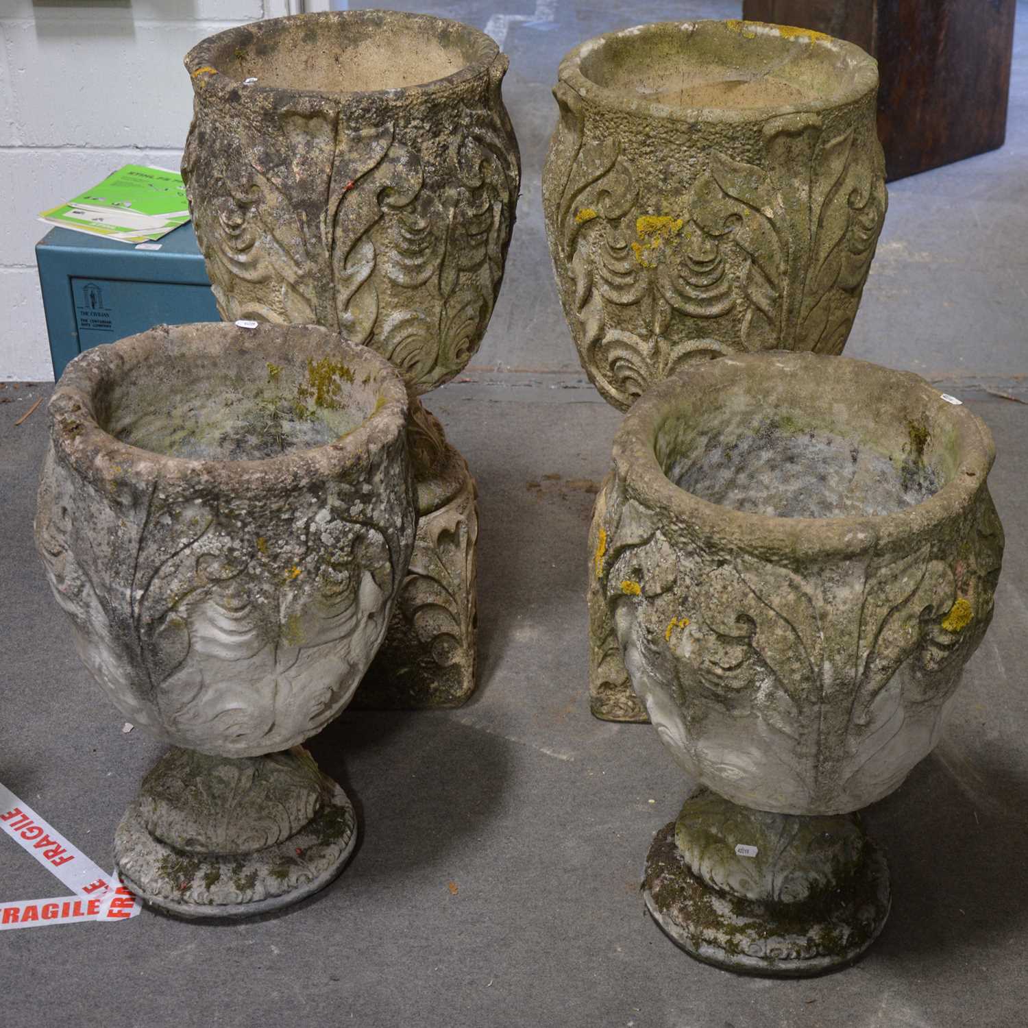 Lot 558 - Two pairs of Haddonstone style garden urns