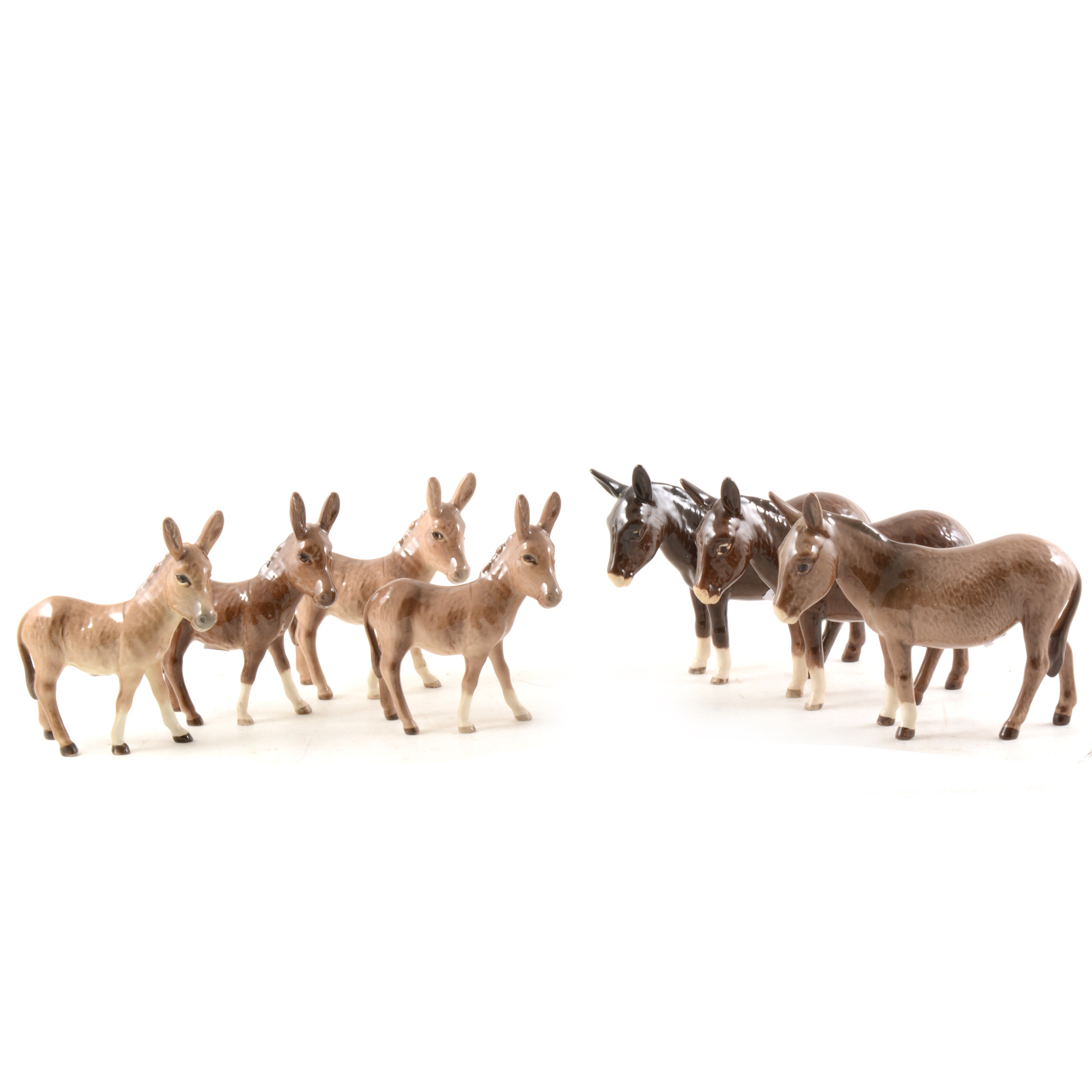 Lot 107 - Seven Beswick donkey figurines