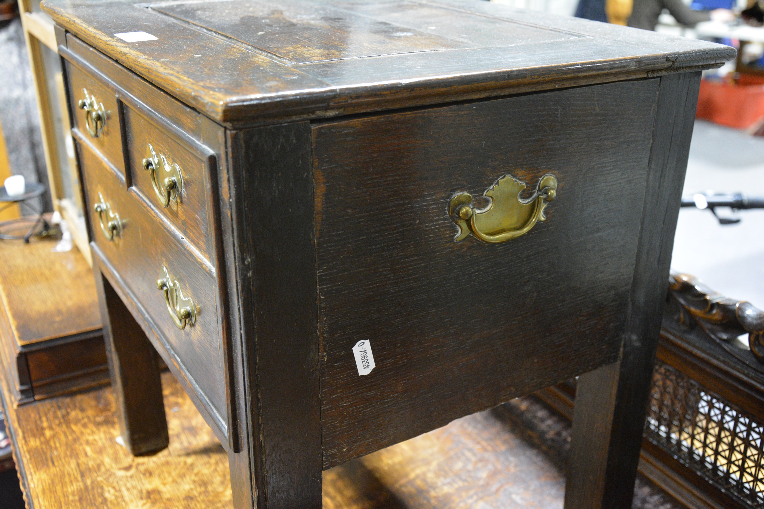 Lot 547 - George III oak commode