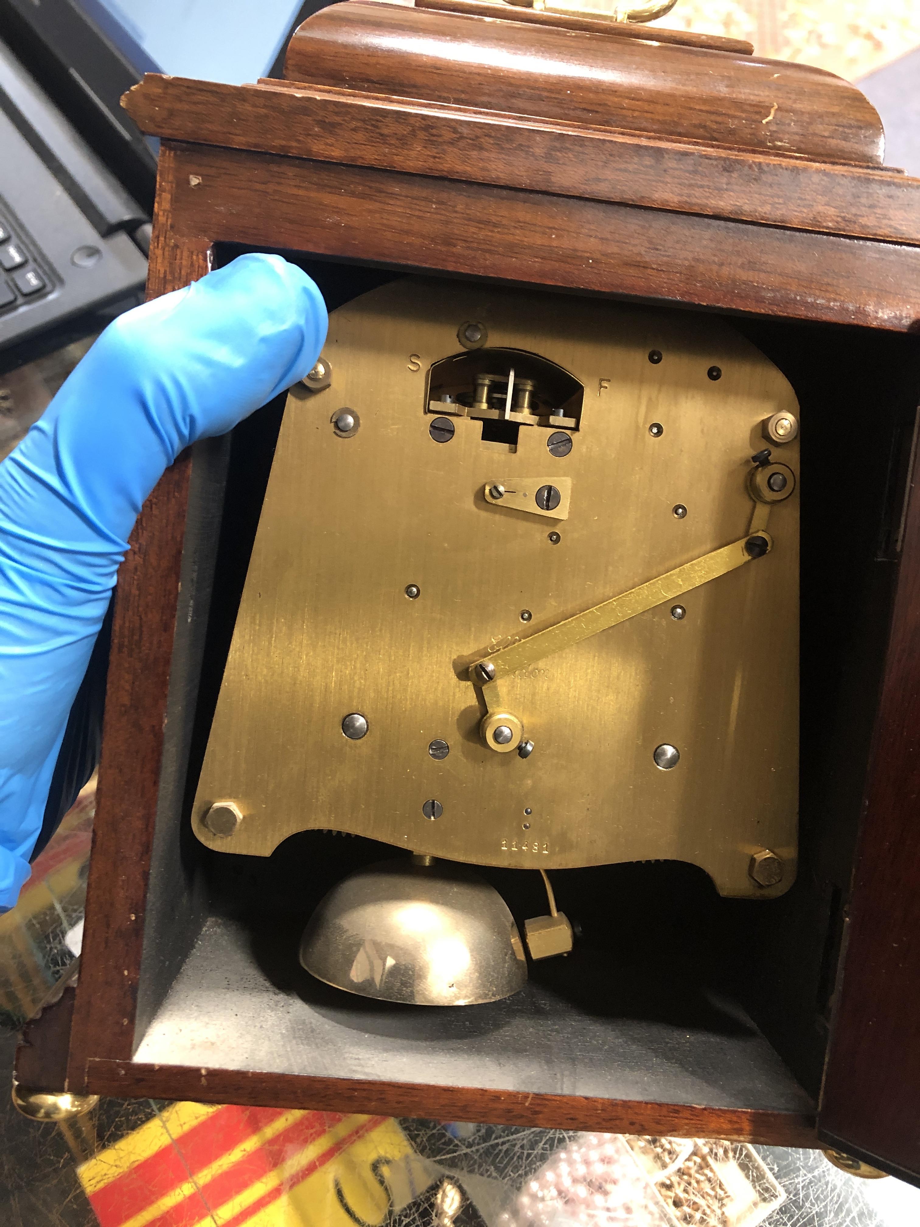 Lot 124 - An Elliott walnut mantel clock