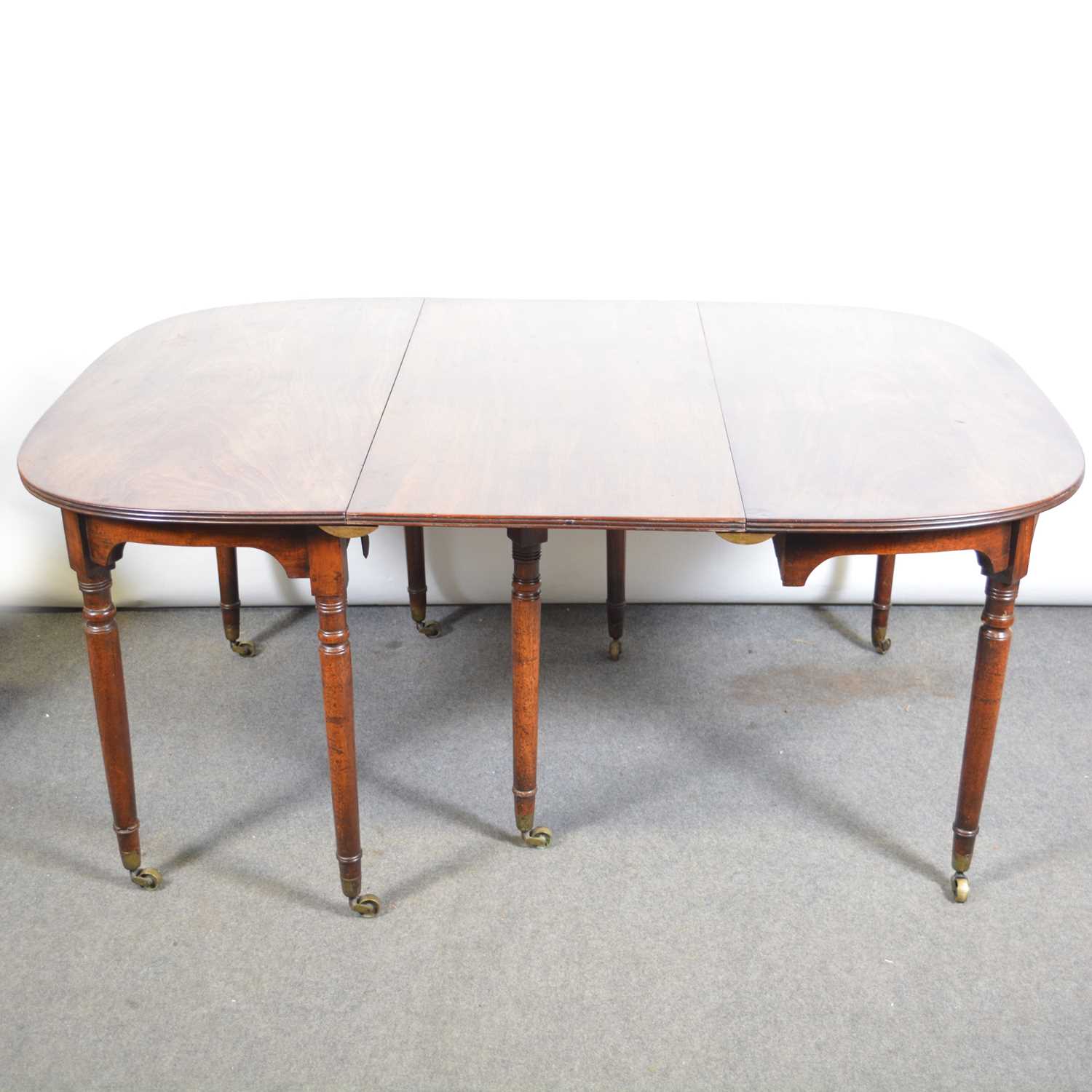 Lot 512 - George III mahogany dining table.