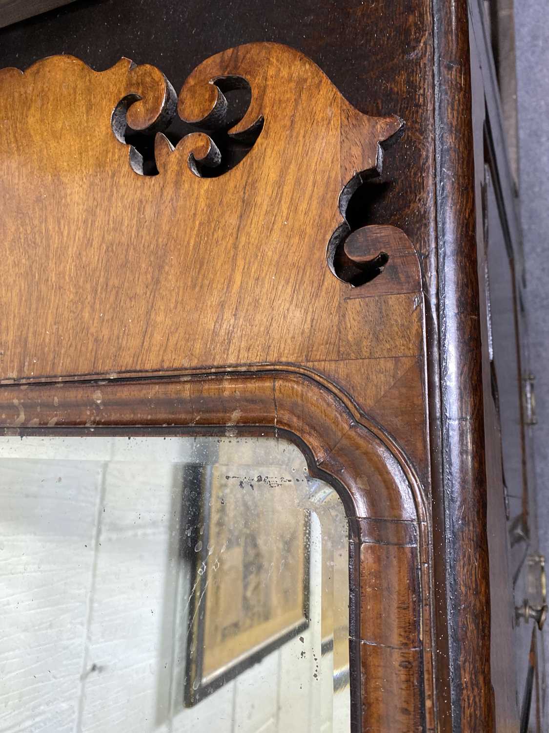 Lot 141 - A walnut pier glass.