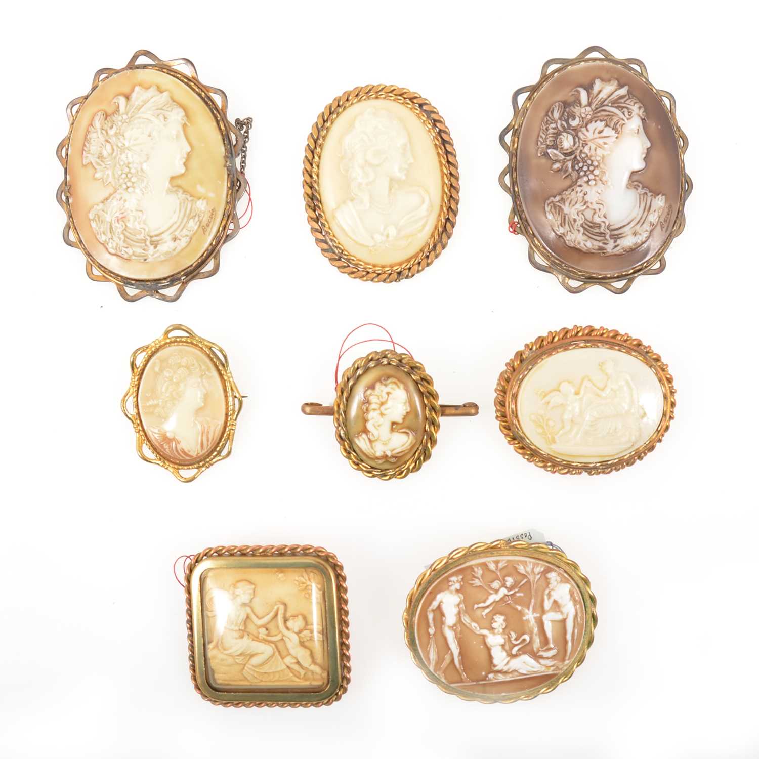 Lot 276 - Eight celluloid cameo brooches in gilt metal