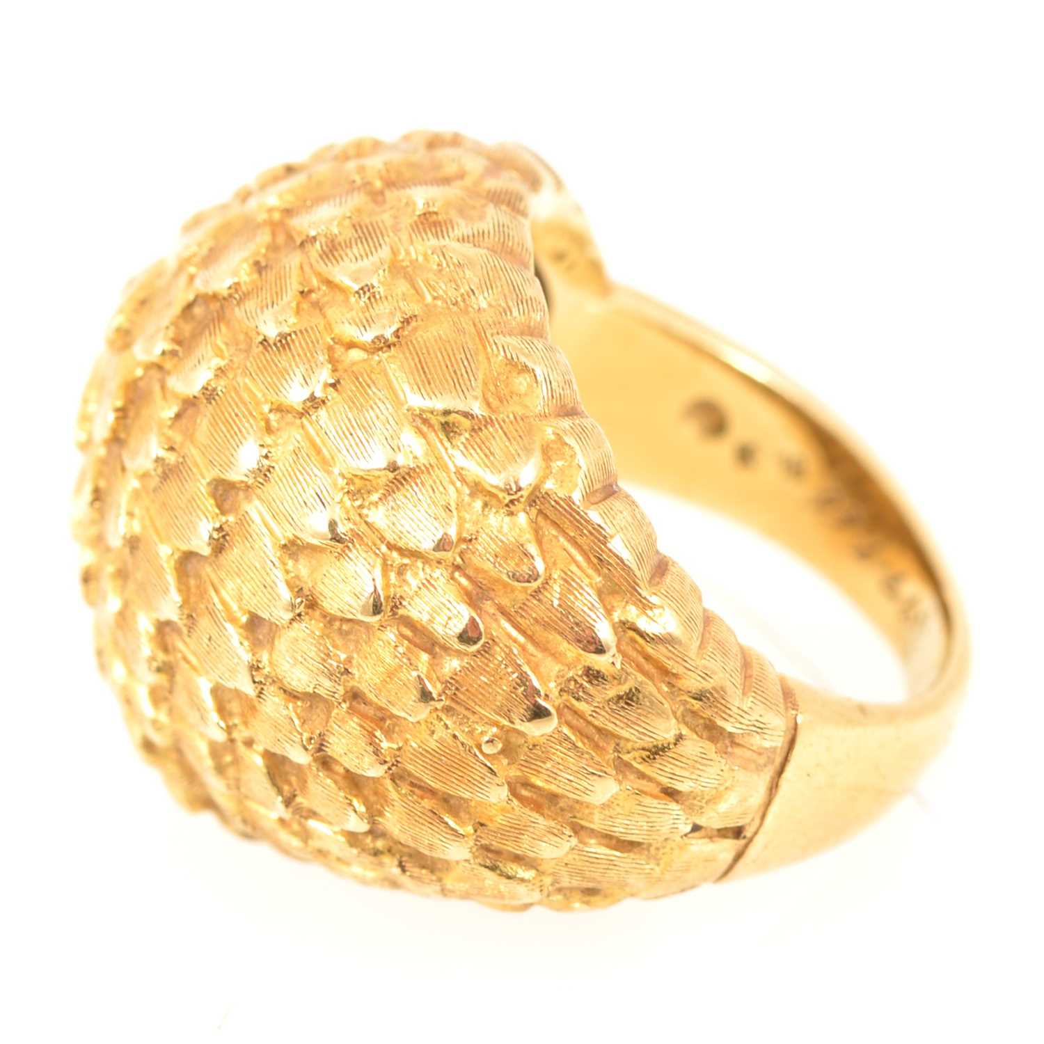 Lot 299 - A yellow metal domed dress ring marked 18K