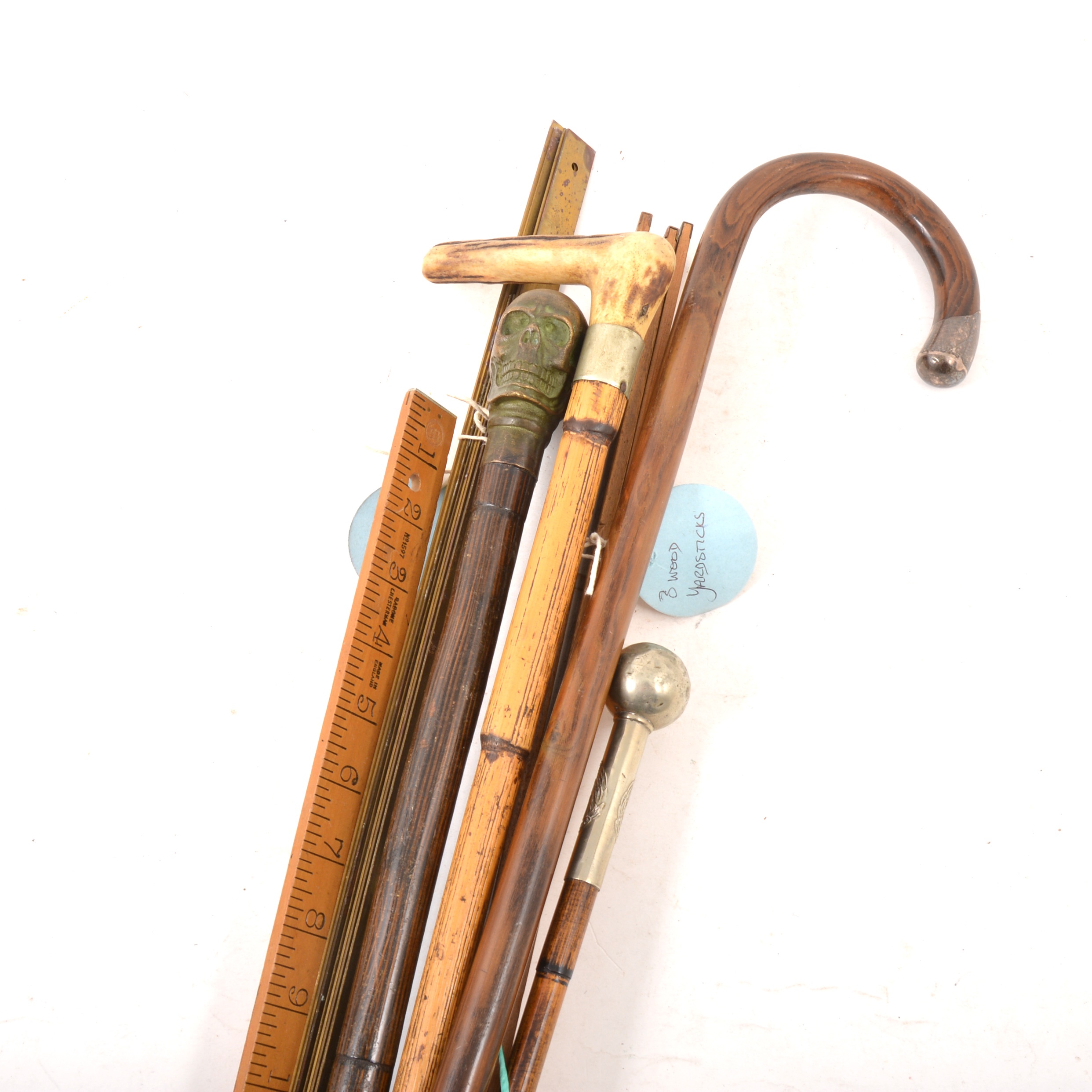 Lot 156 - A selection of walking sticks and yardsticks