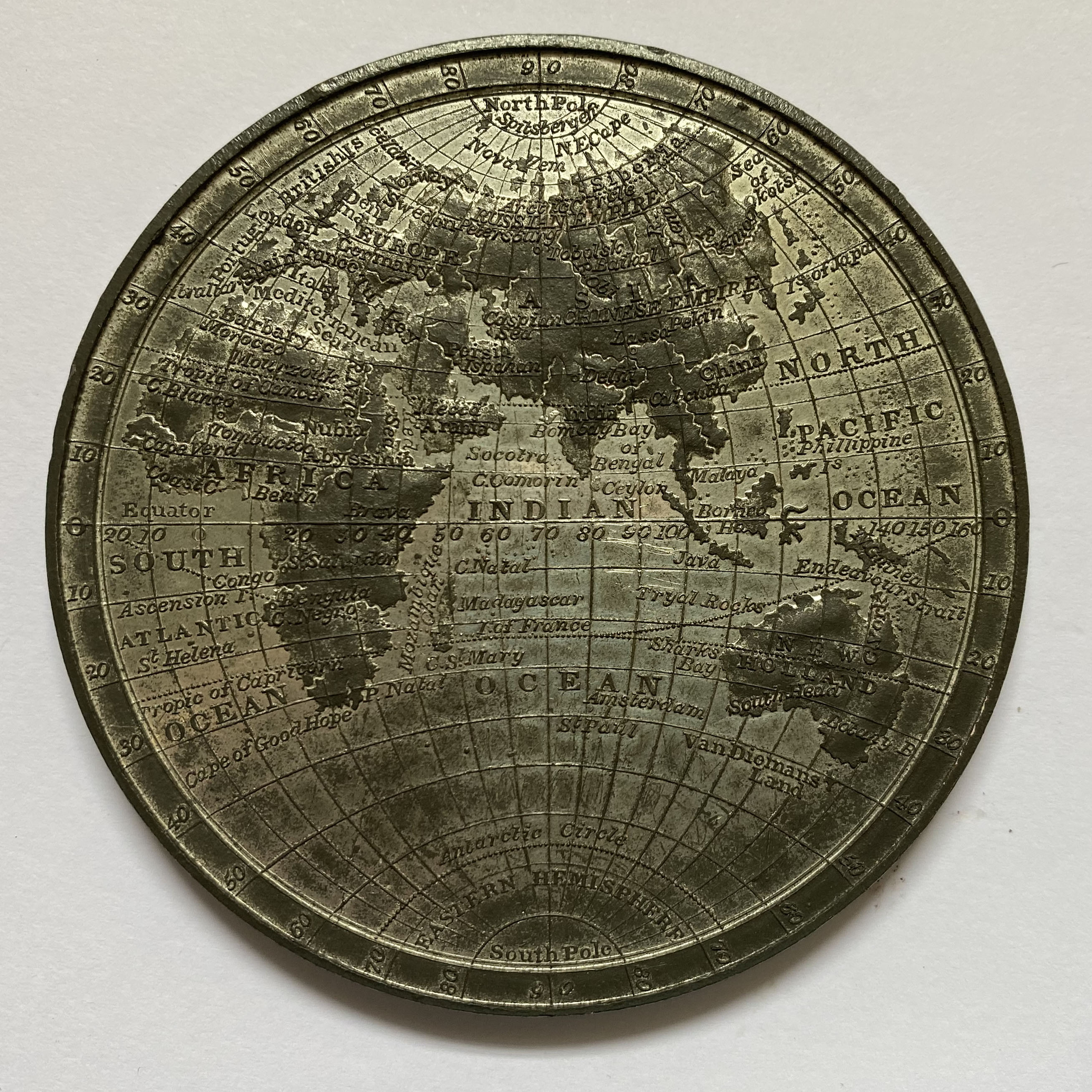 Lot 110 - White metal medallion, "Map of the World",