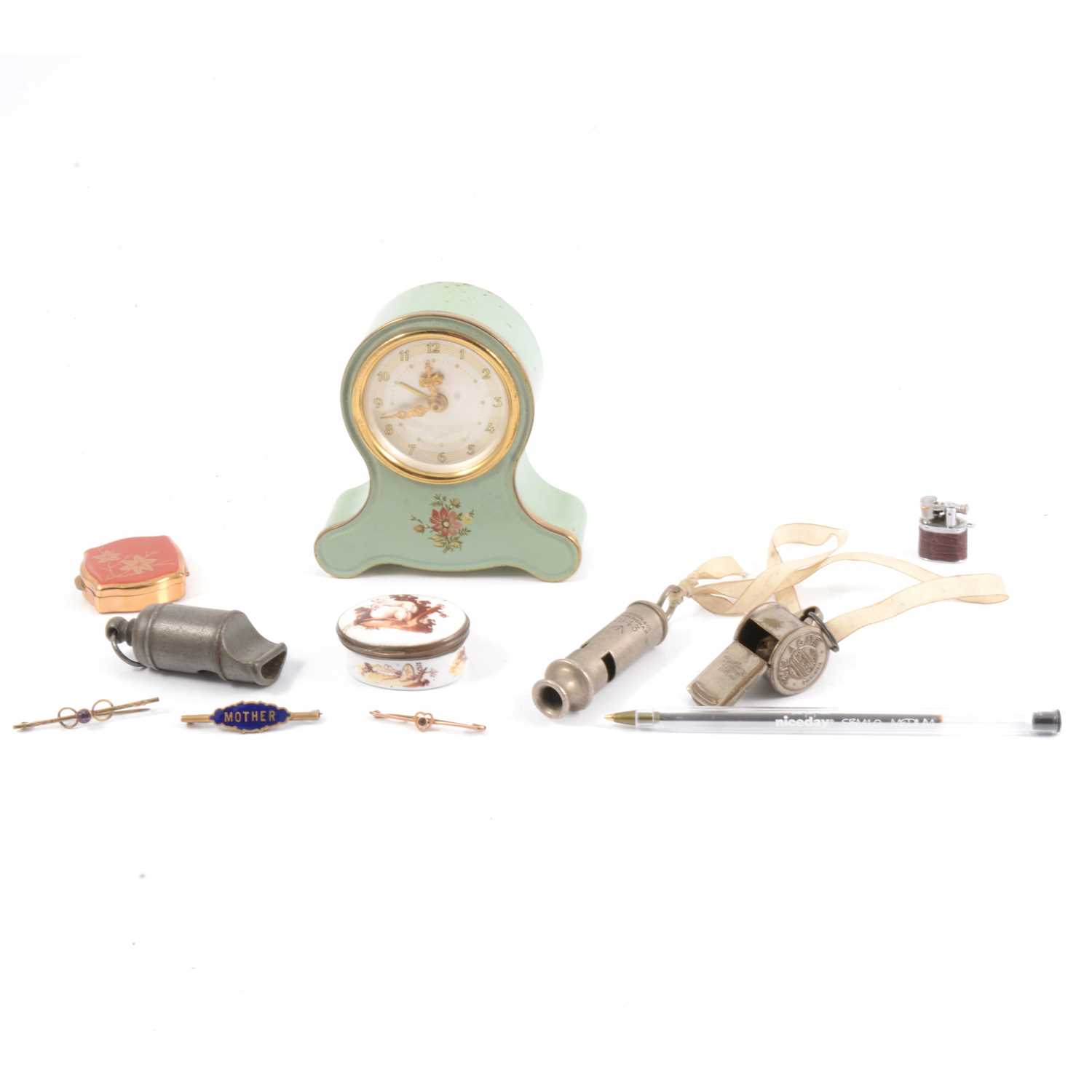 Lot 257 - A military issue whistle and two other,