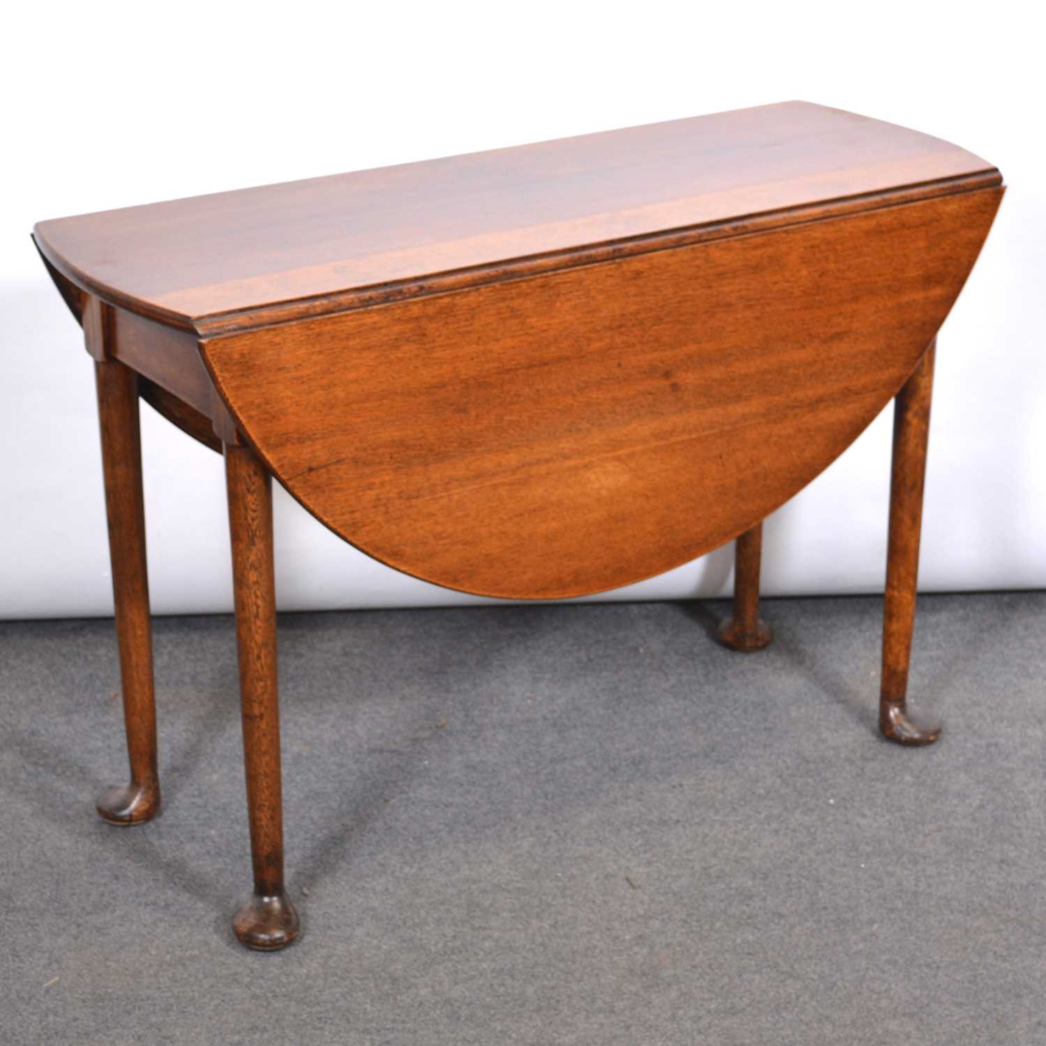Lot 444 - George III oak dropleaf table