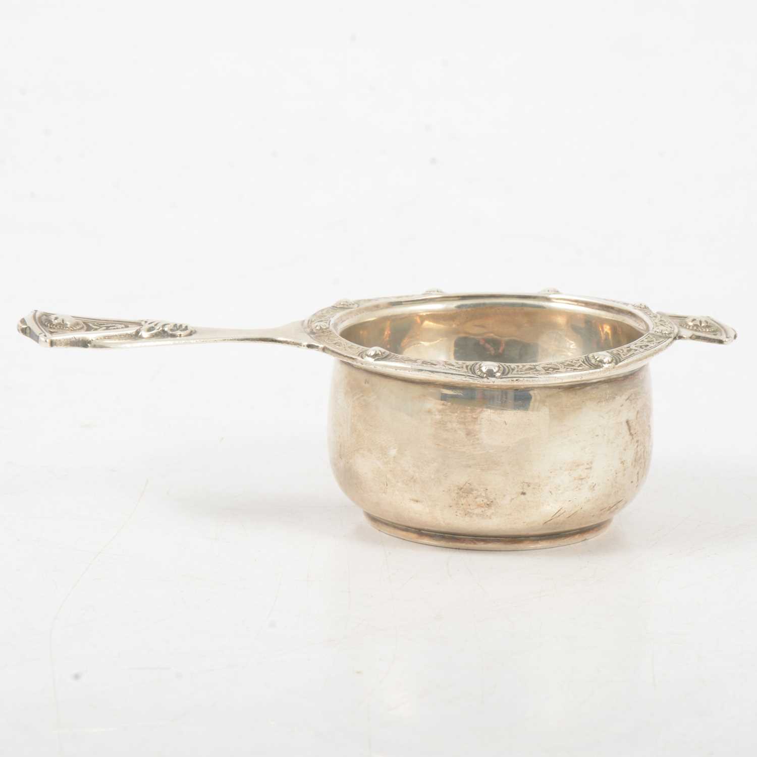Lot 257 - Silver tea strainer and bowl, Adie Brothers