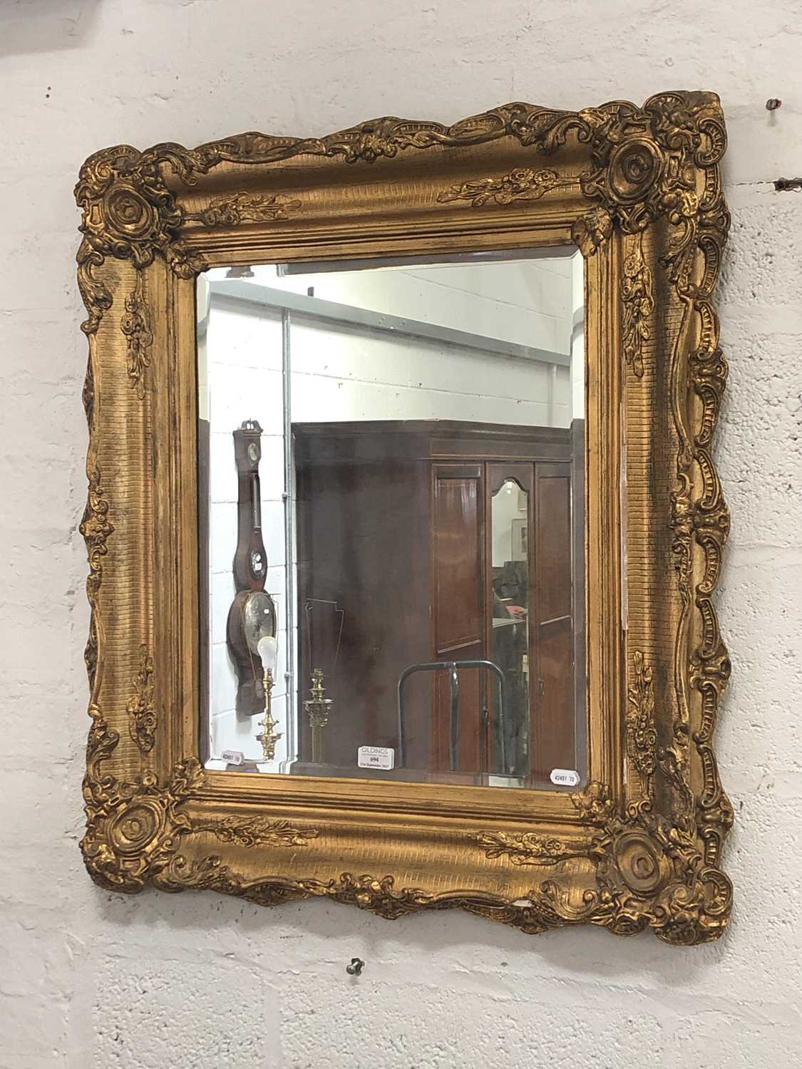 Lot 694 - Reproduction gilt framed wall mirror,