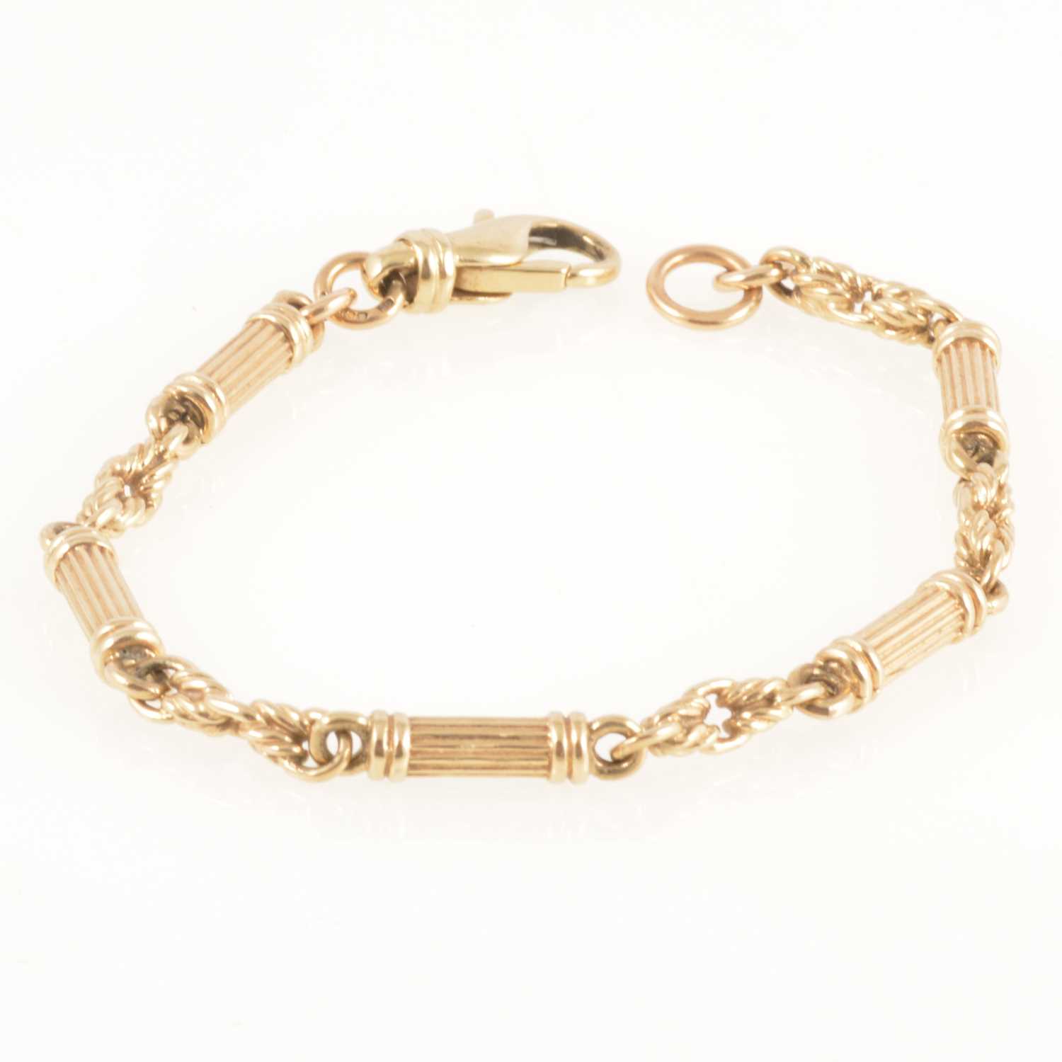 Lot 254 - A 9 carat gold barrel link chain bracelet.