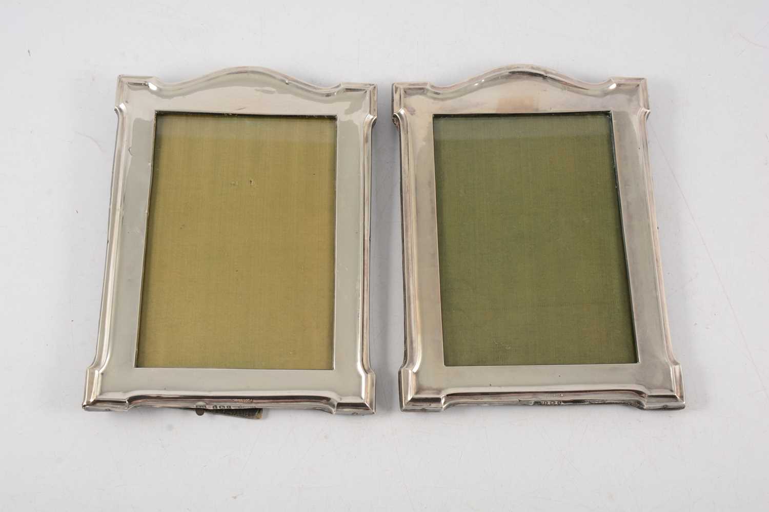 Lot 184 - Two silver strut back photograph frames,