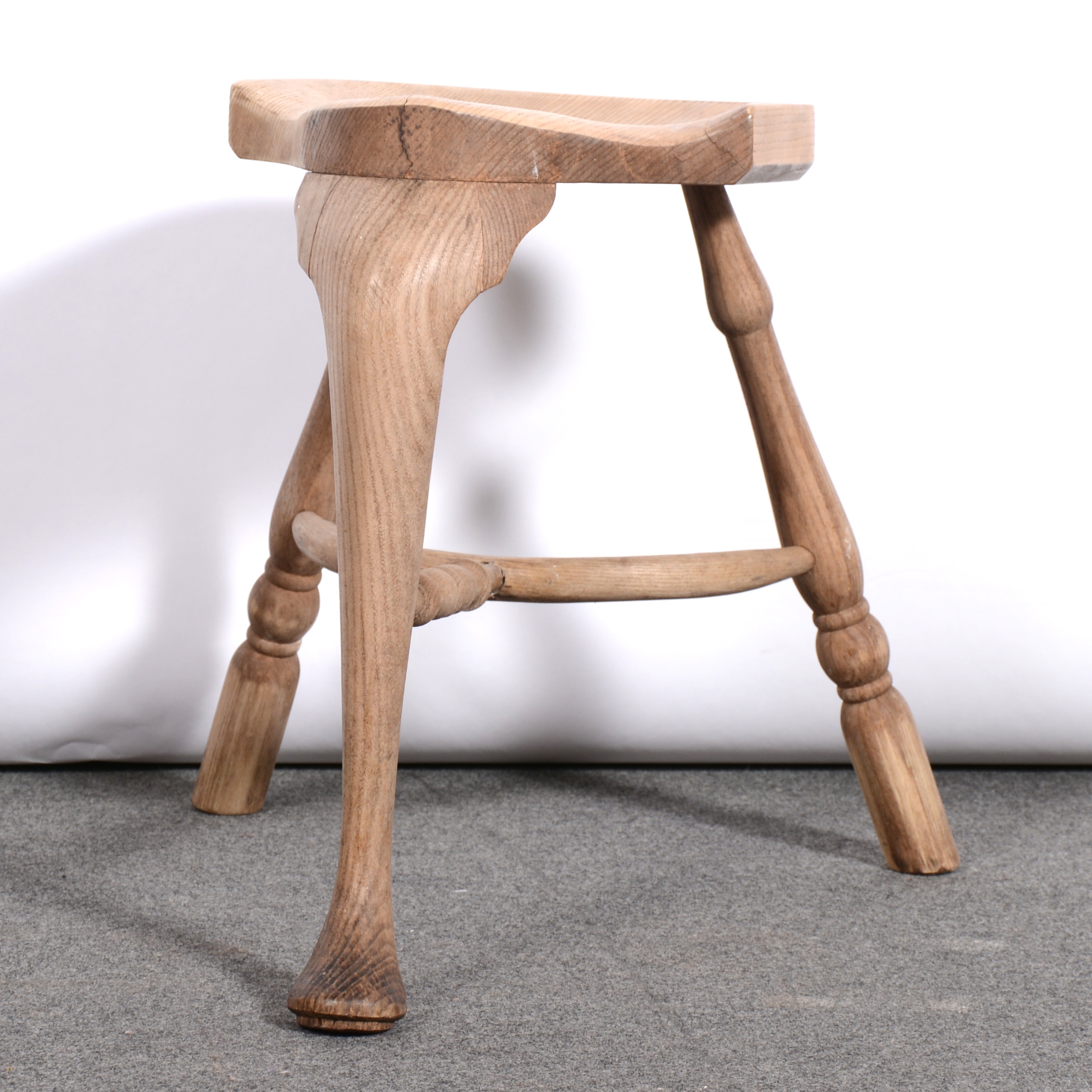 Lot 432 - Ash milking stool, crinoline stretcher, and