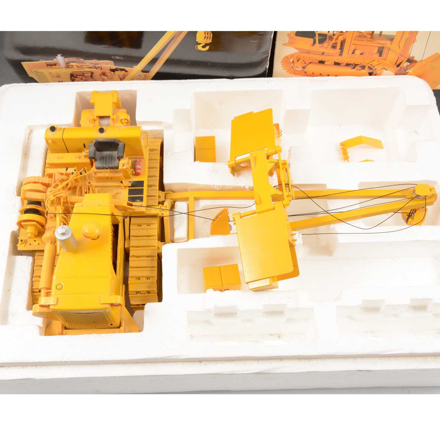 Lot 318 - Three construction vehicle models;