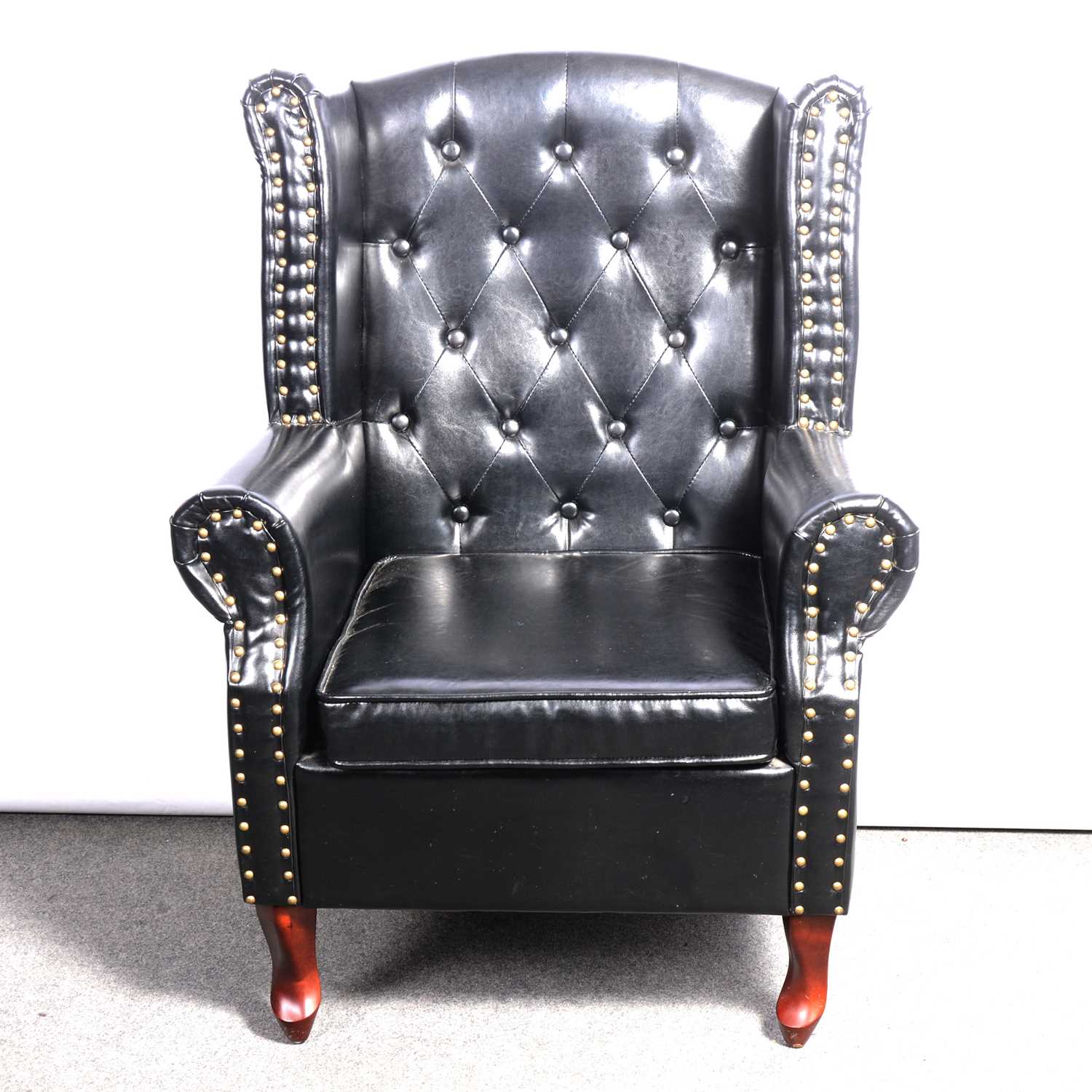 Lot 598 - Wing back easy chair, simulated leather