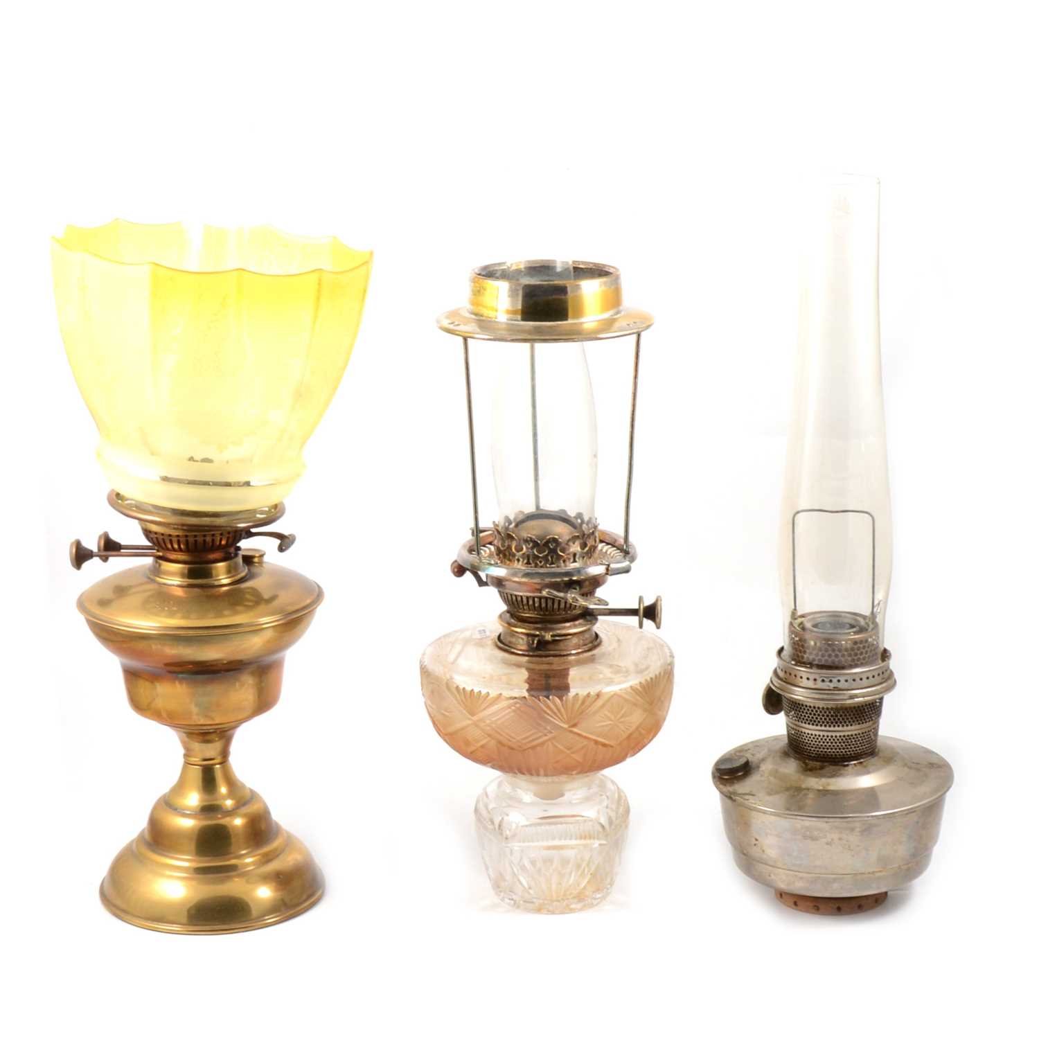 Lot 155 - Cut glass oil lamp, a brass oil lamp, and