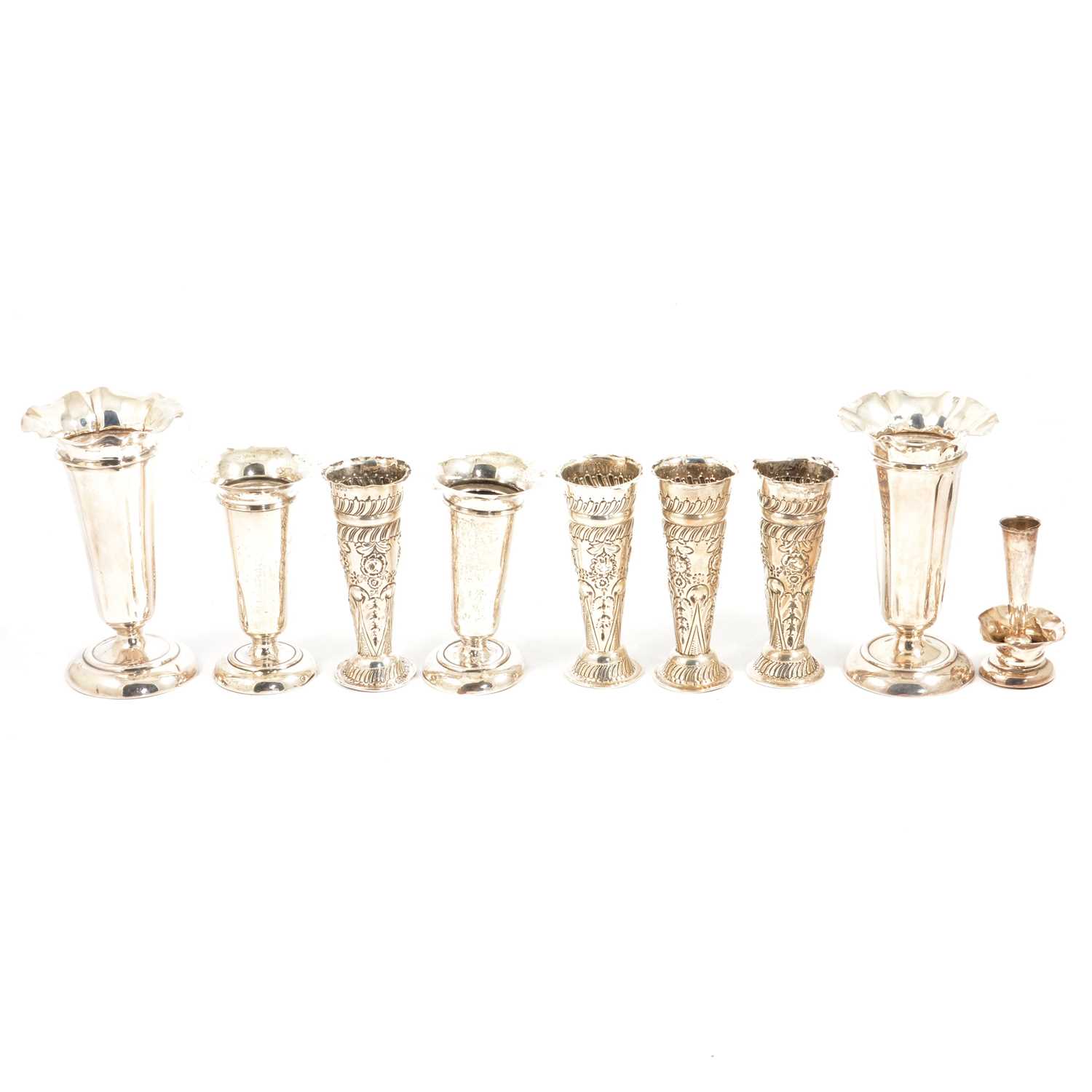 Lot 228 - Nine filled silver spill vases, four with