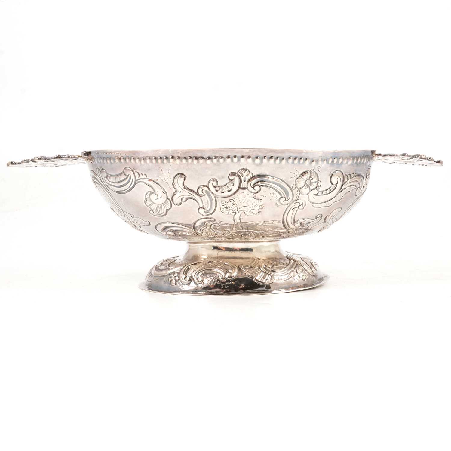 Lot 498 - A repousse chased Dutch silver twin handled
