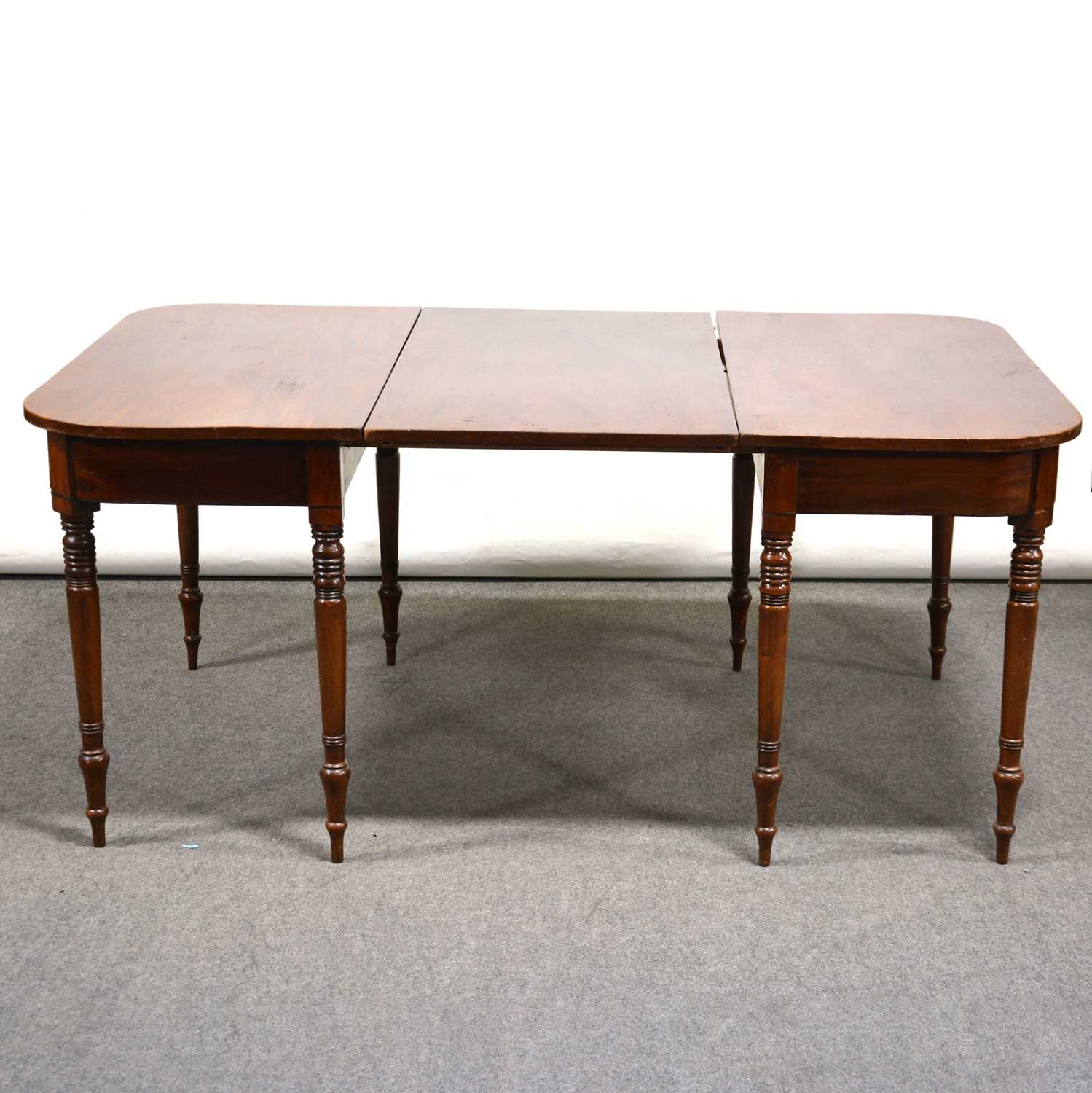 Lot 370 - George III mahogany dining table and six