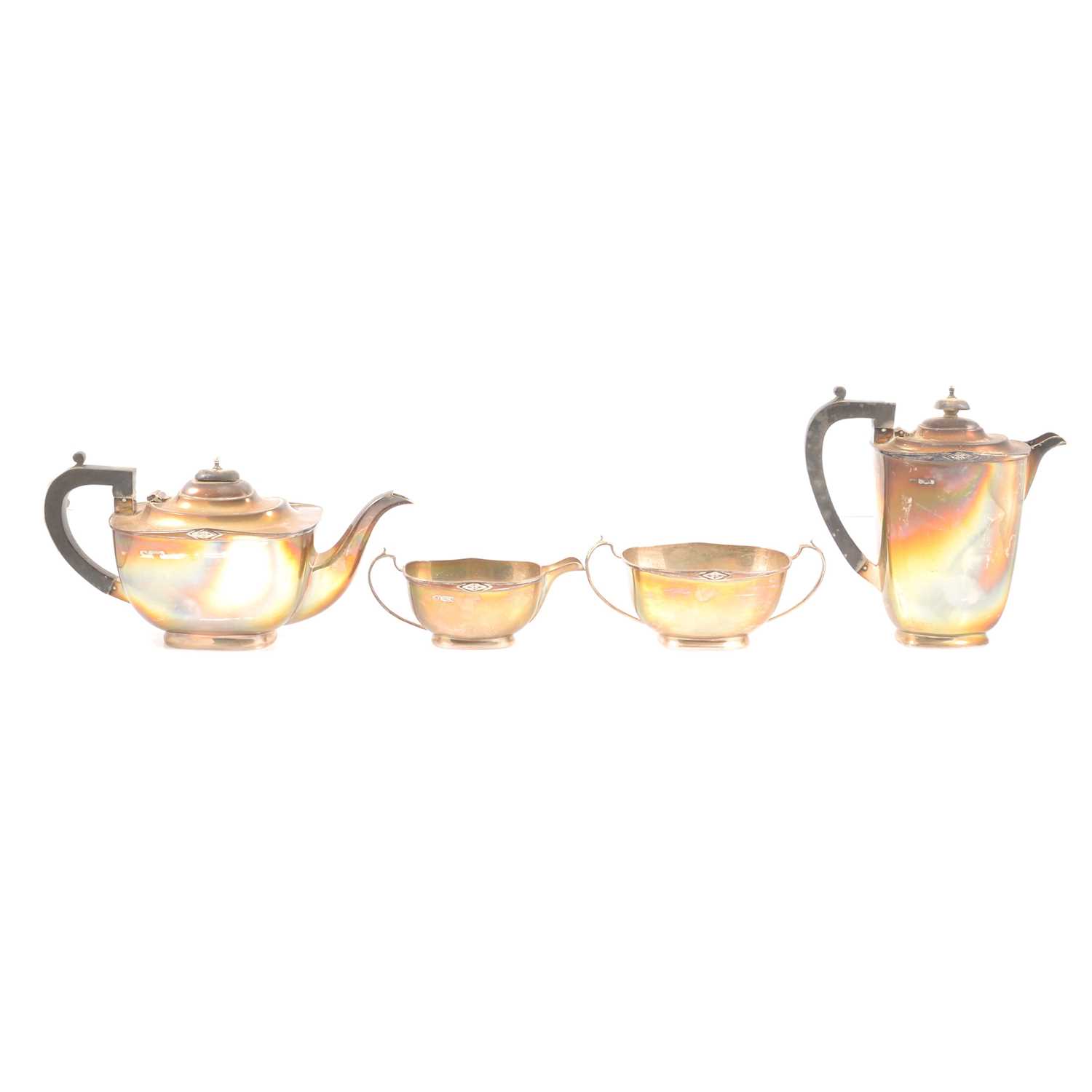 Lot 340 - A silver four piece tea set by George Wish